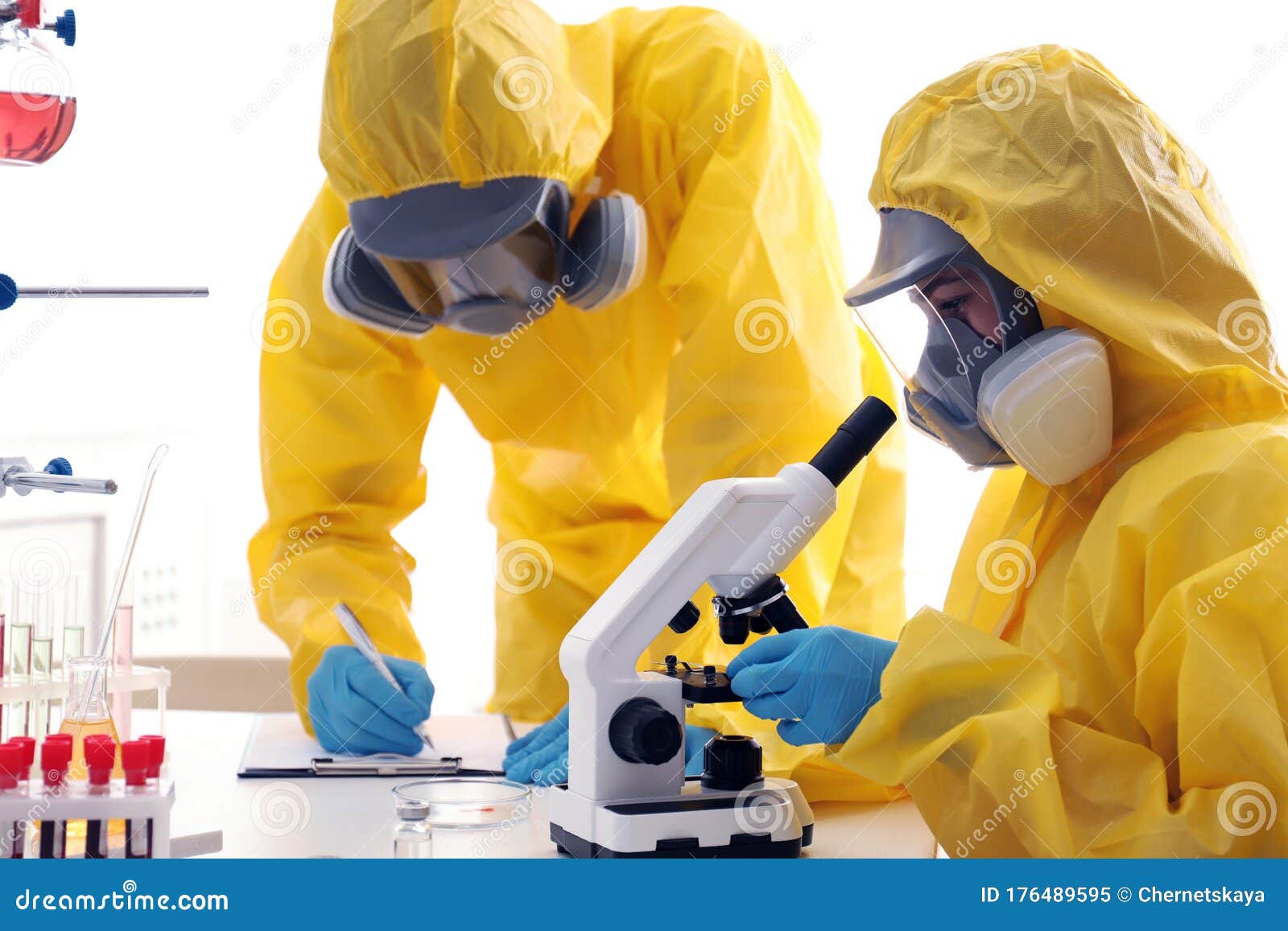Scientists in Chemical Protective Suits Working. Virus Research Stock ...