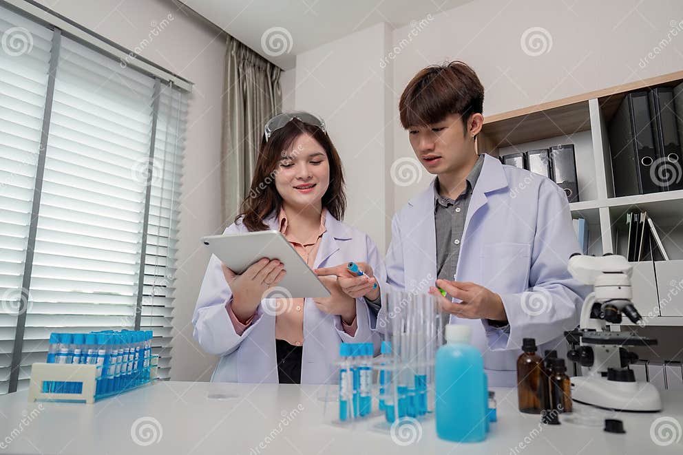 Scientists Collaborating on Tablet for Enhanced Laboratory Research ...