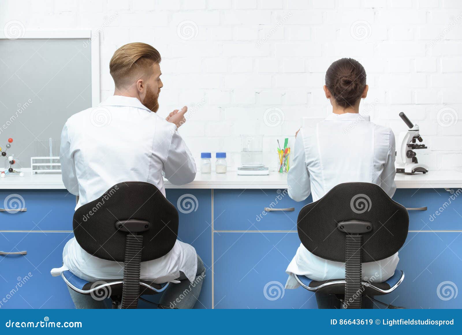 Scientists Discussing Analysis during Work in Lab Stock Image - Image ...