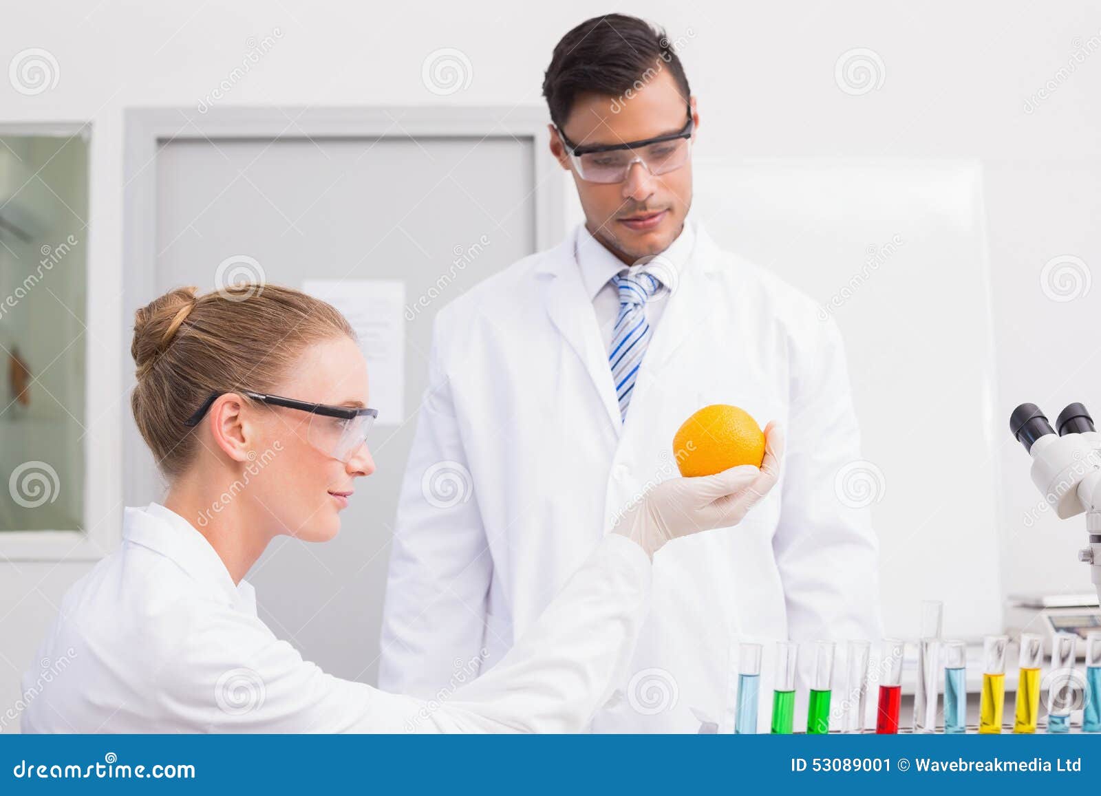 Scientists Doing Experimentations on Orange Stock Image - Image of ...
