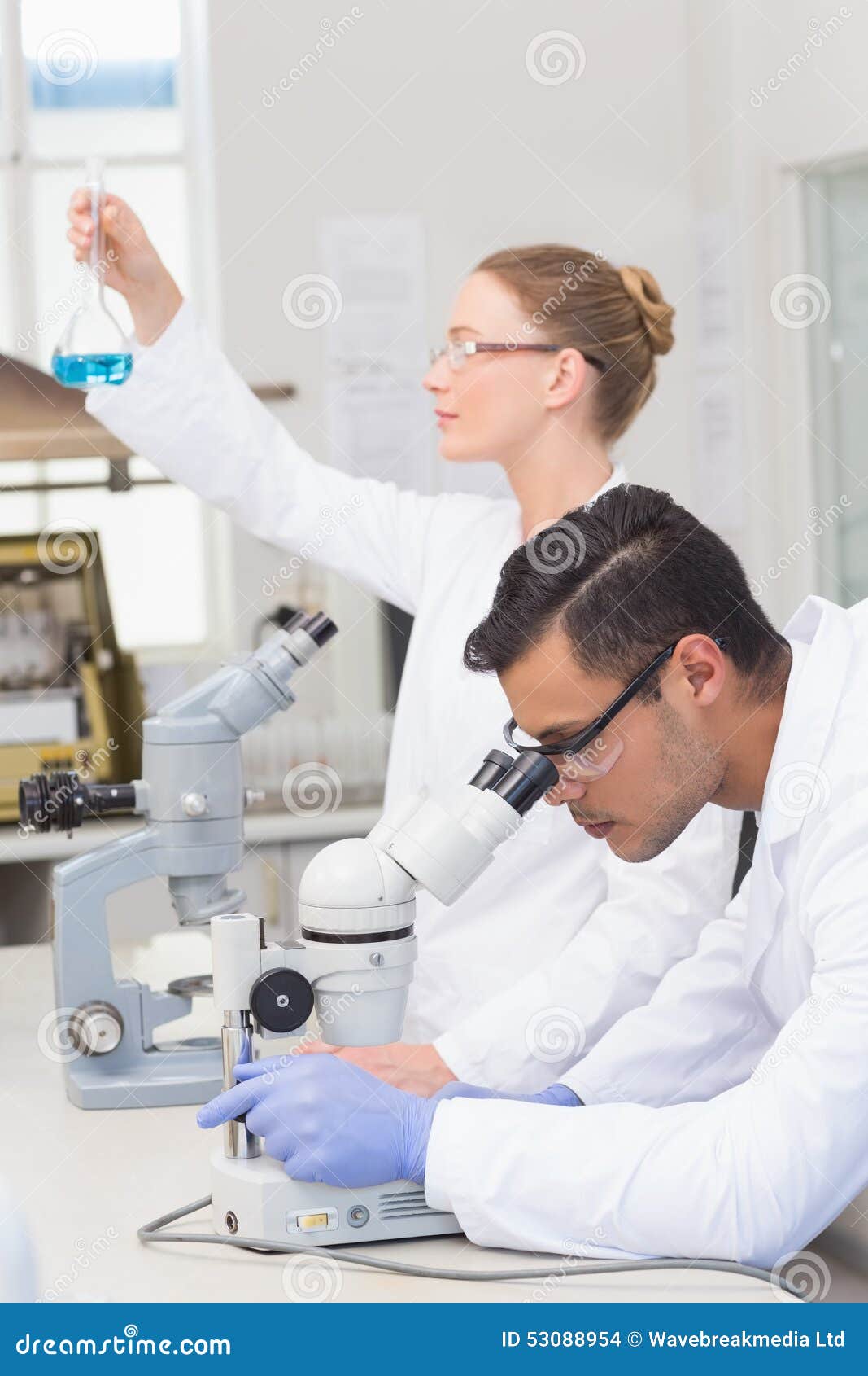 Scientists Examining Blue Precipitate Stock Photo - Image of coat ...