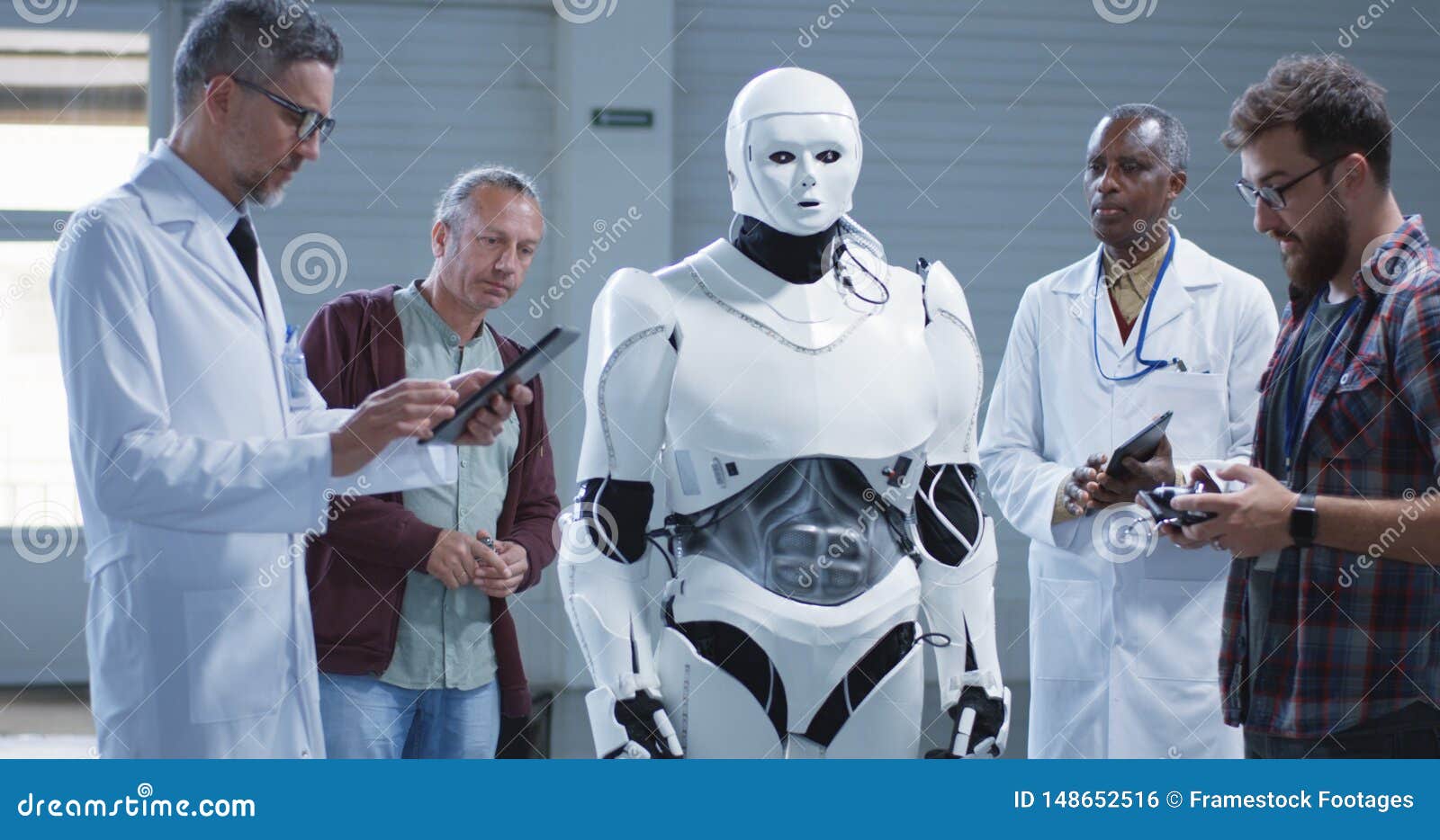 Scientists Examining a Humanoid Robot Stock Photo - Image of modern ...