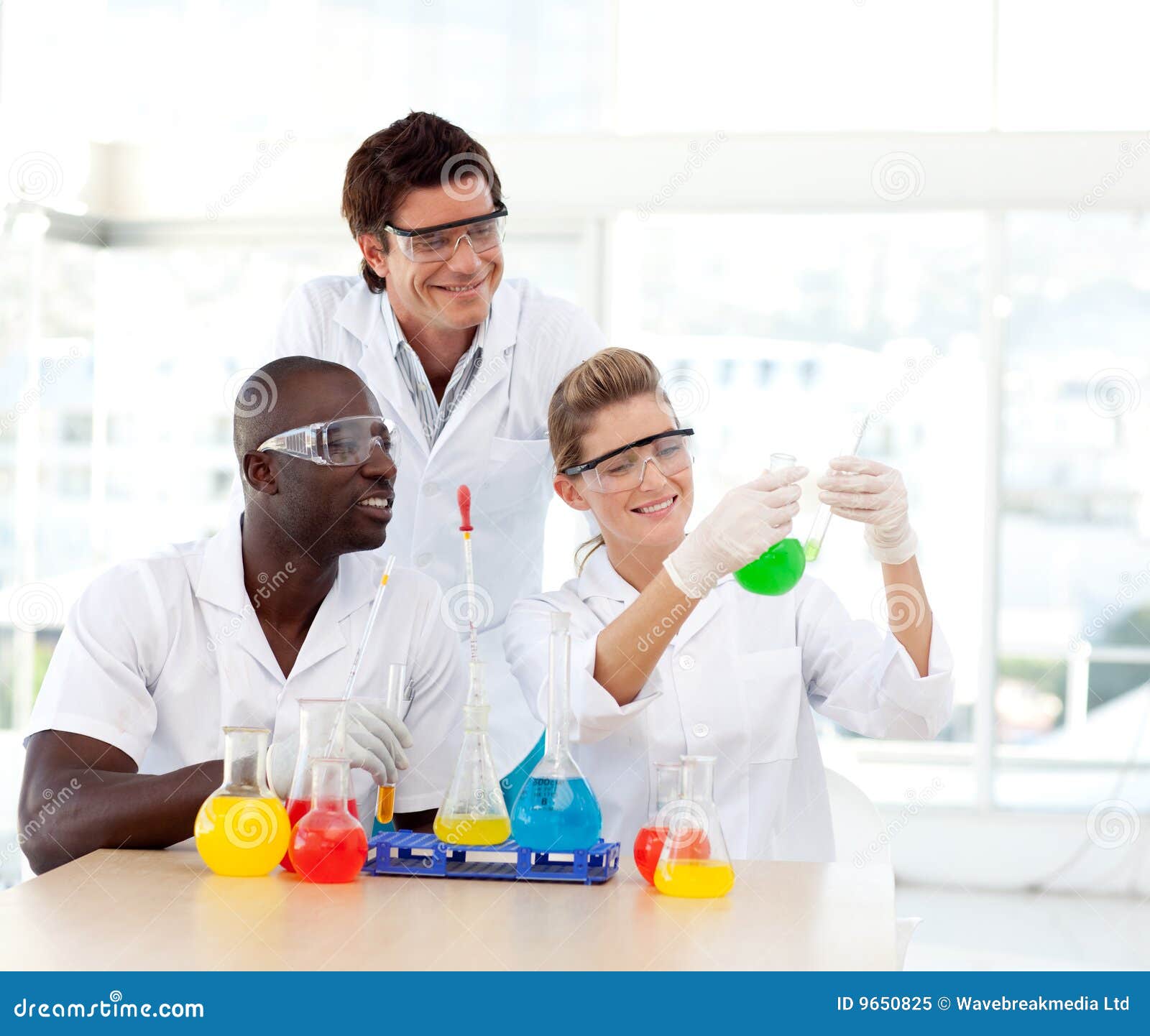 Scientists Examining a Test-tube Stock Image - Image of measure, male ...