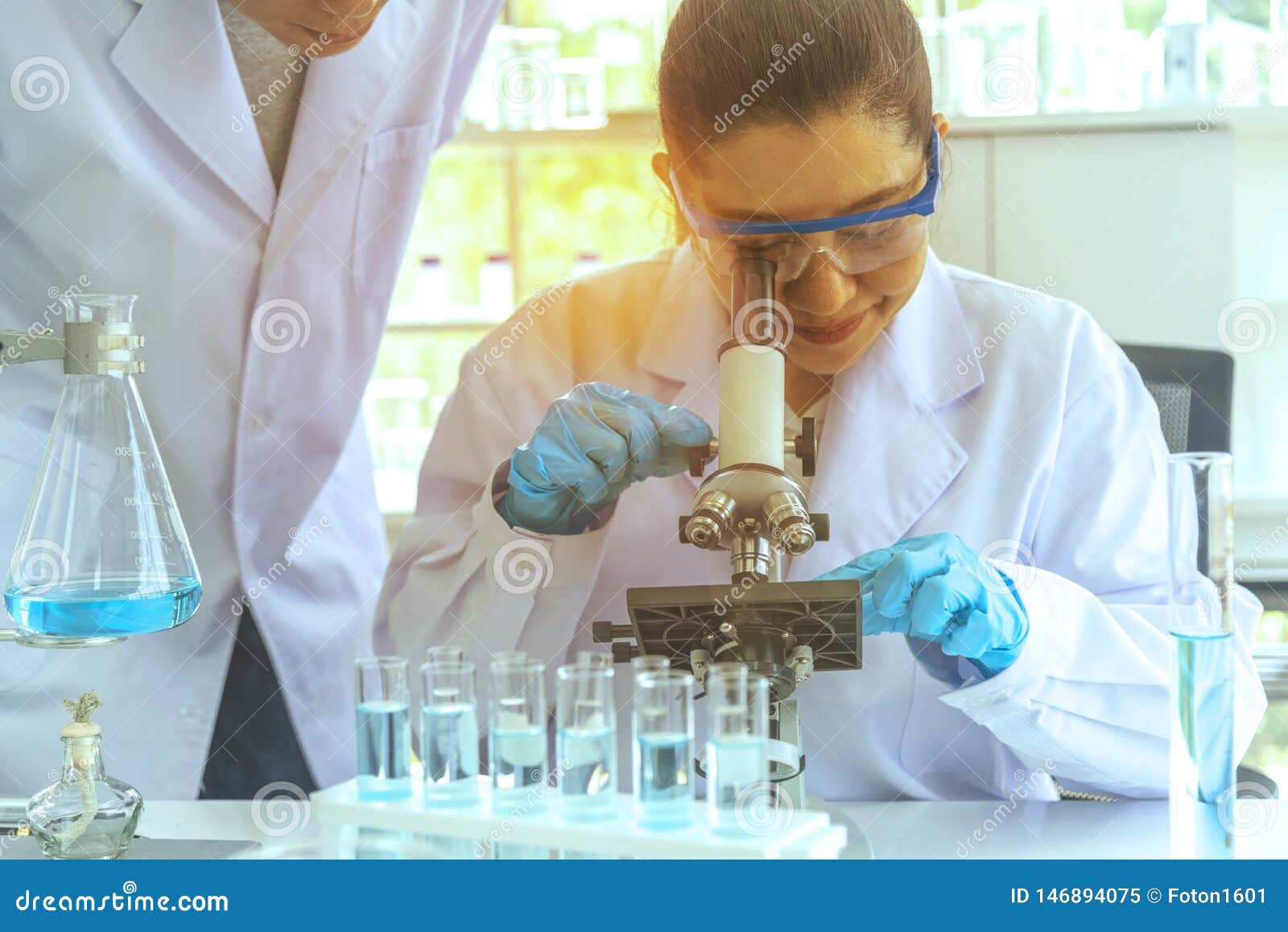 Scientists are Explaining Experiments by Scanning the Microscope in the ...