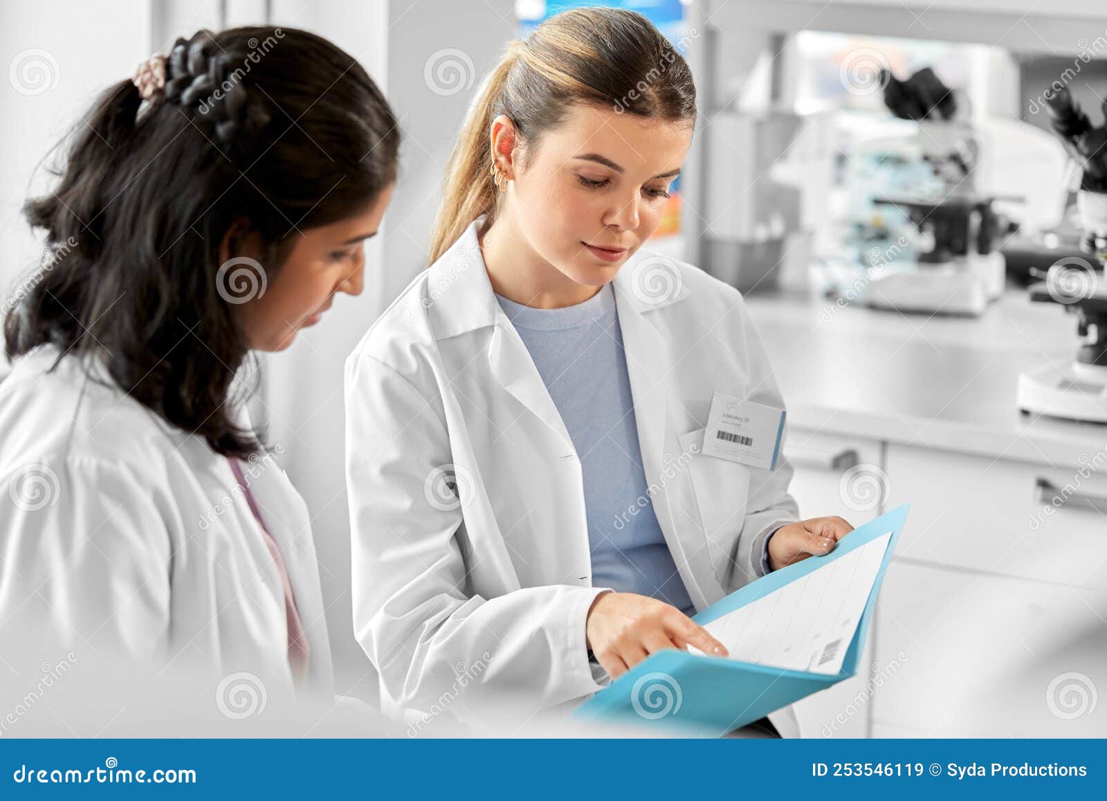 Scientists with Folder Working in Laboratory Stock Image - Image of ...