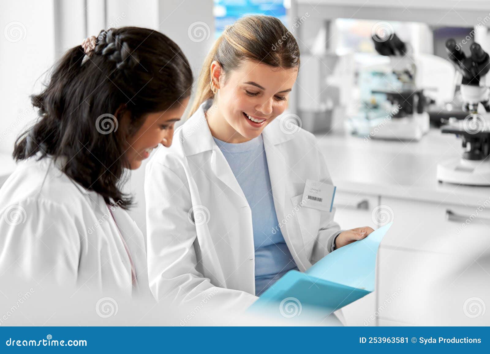 Scientists with Folder Working in Laboratory Stock Image - Image of ...