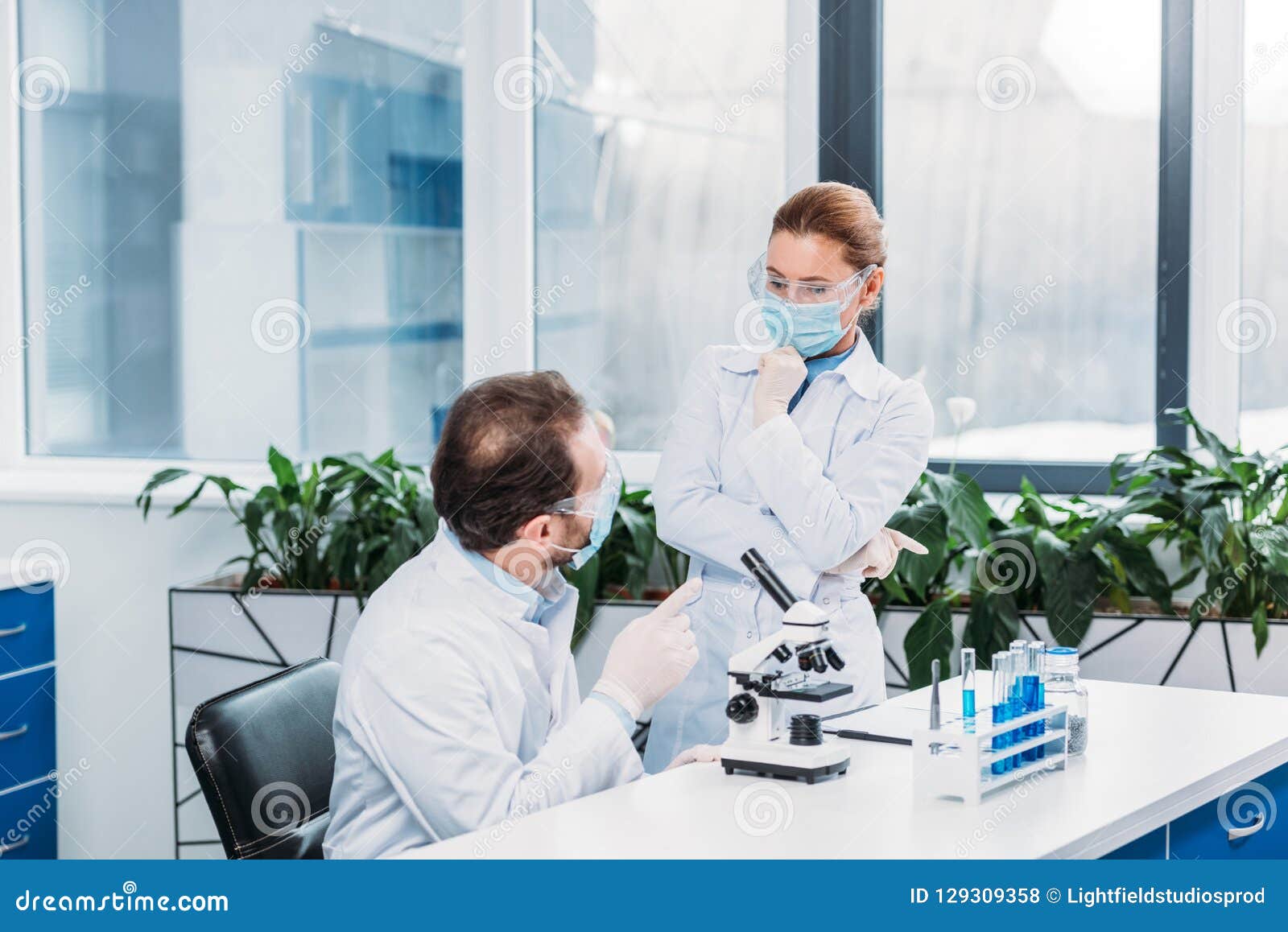 Scientists Having Discussion at Workplace Stock Photo - Image of ...