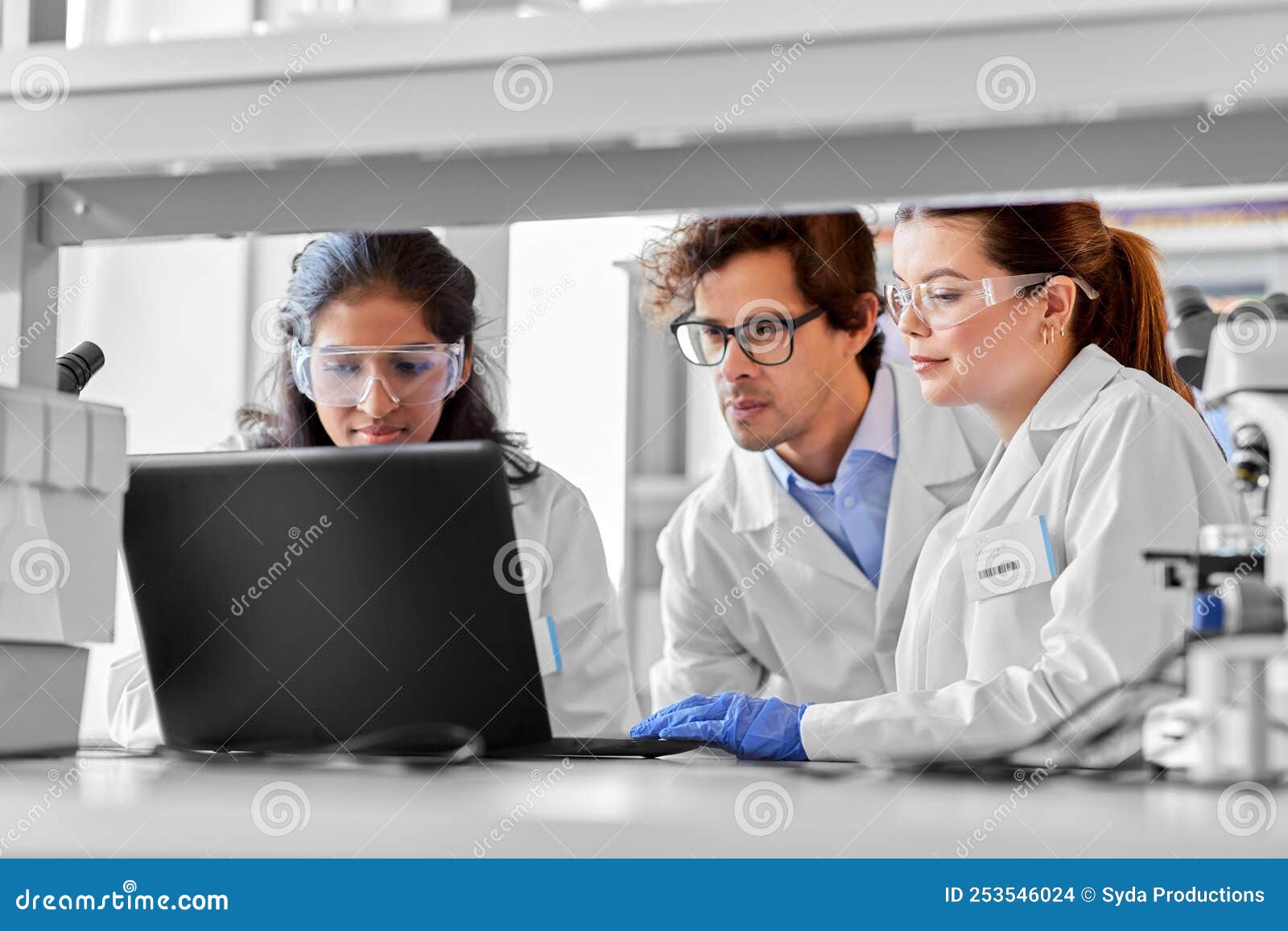Scientists with Laptop Working in Laboratory Stock Photo - Image of ...