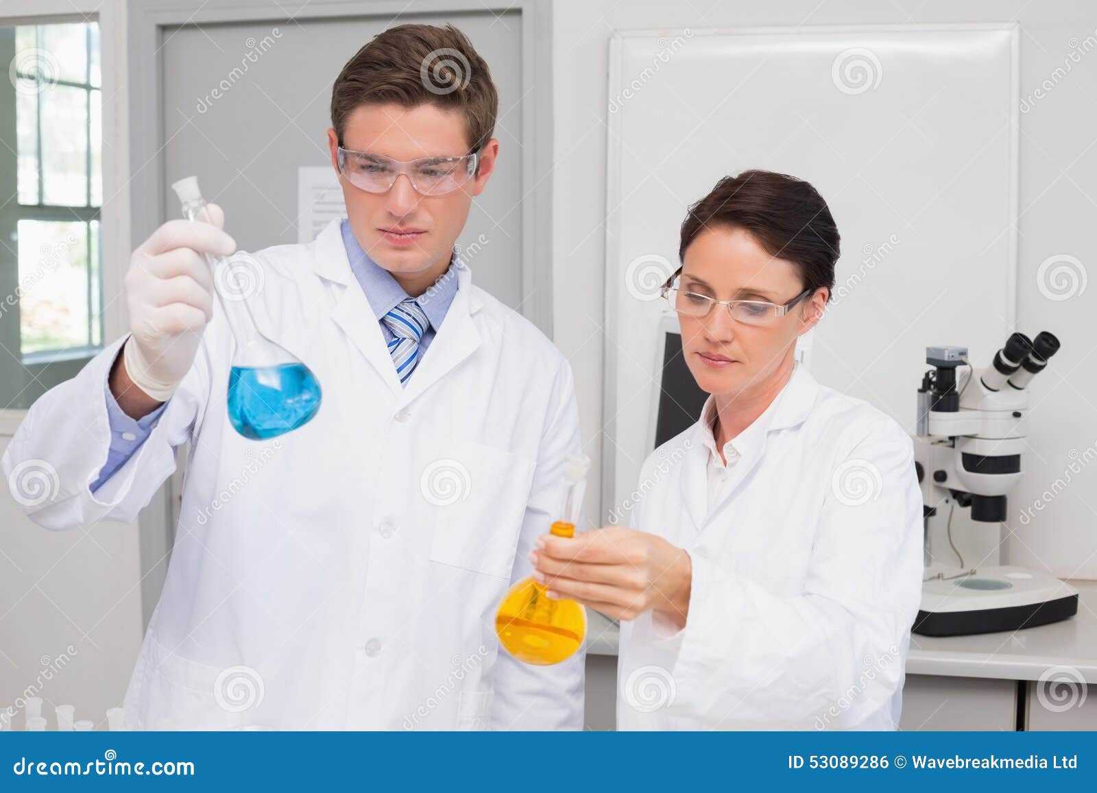 Scientists Looking Attentively at Beakers Stock Photo - Image of adult ...
