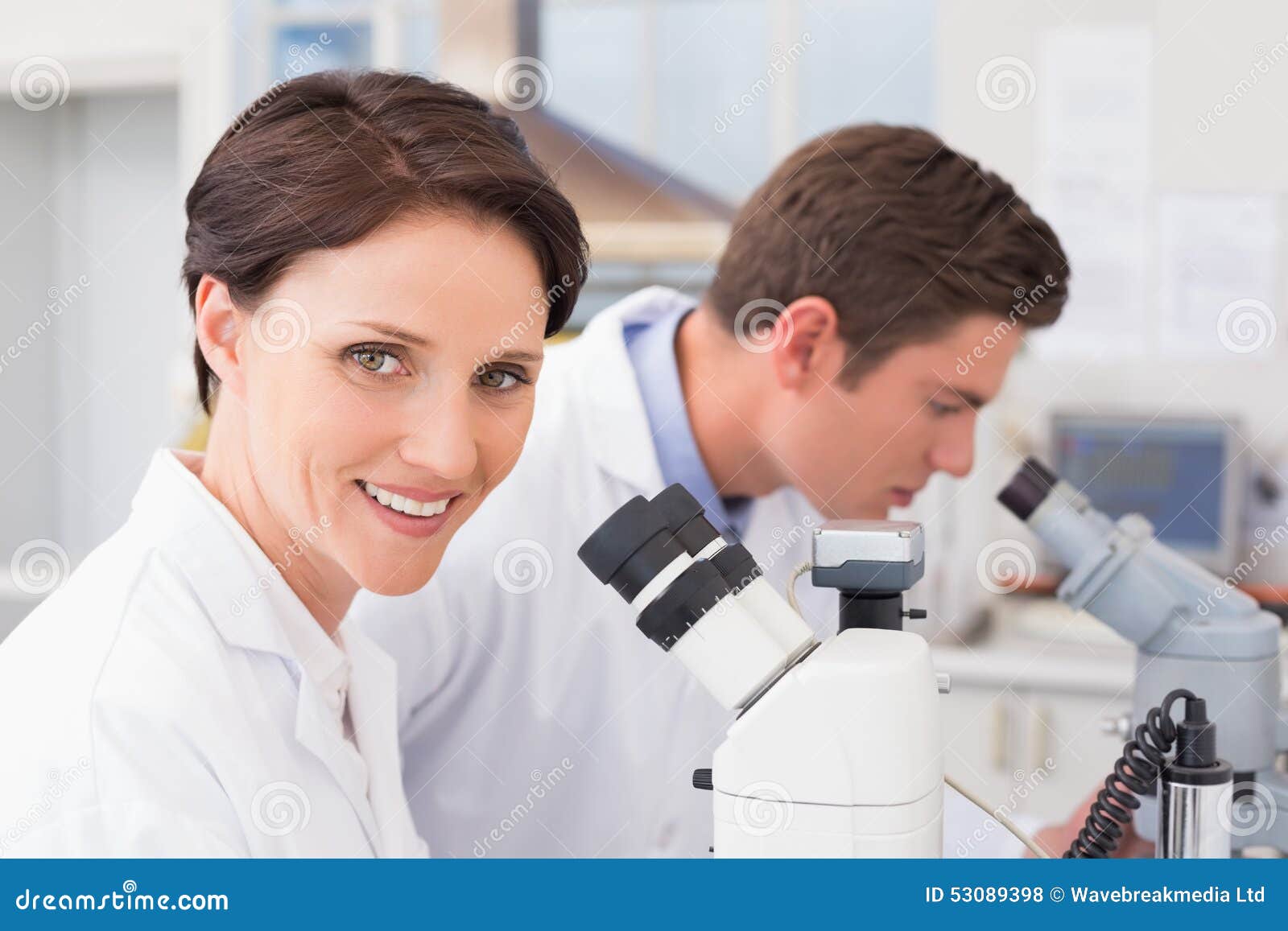 Scientists Looking Attentively in Microscopes Stock Photo - Image of ...