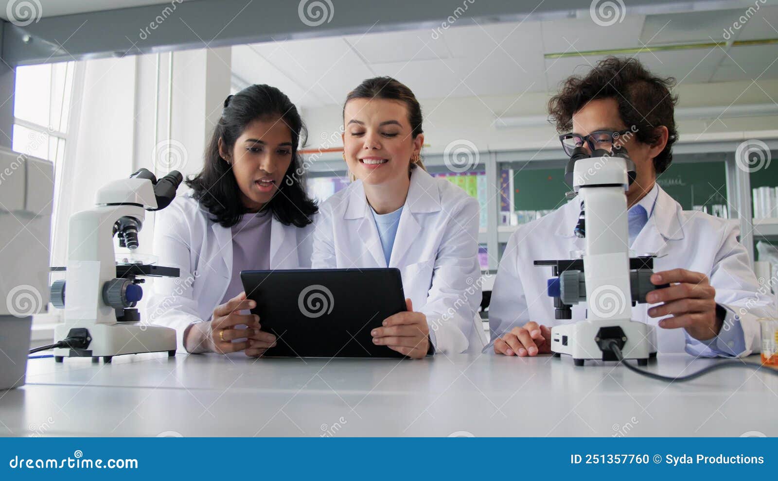 Scientists with Microscopes Working in Laboratory Stock Footage - Video ...