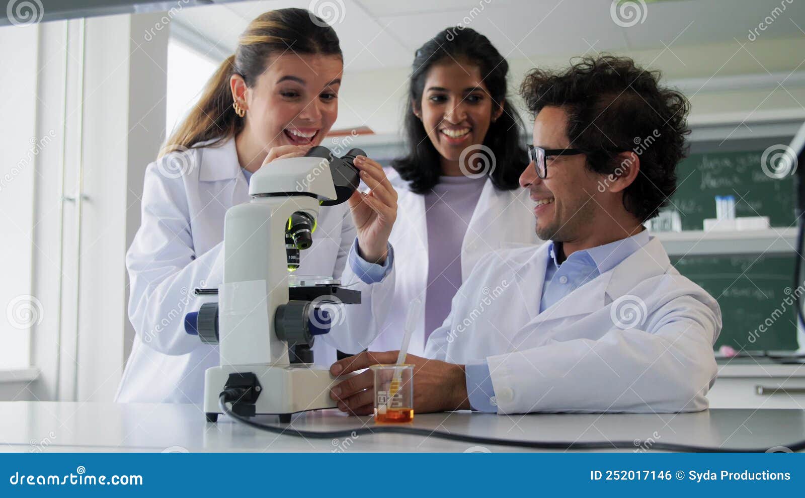 Scientists with Microscopes Working in Laboratory Stock Footage - Video ...