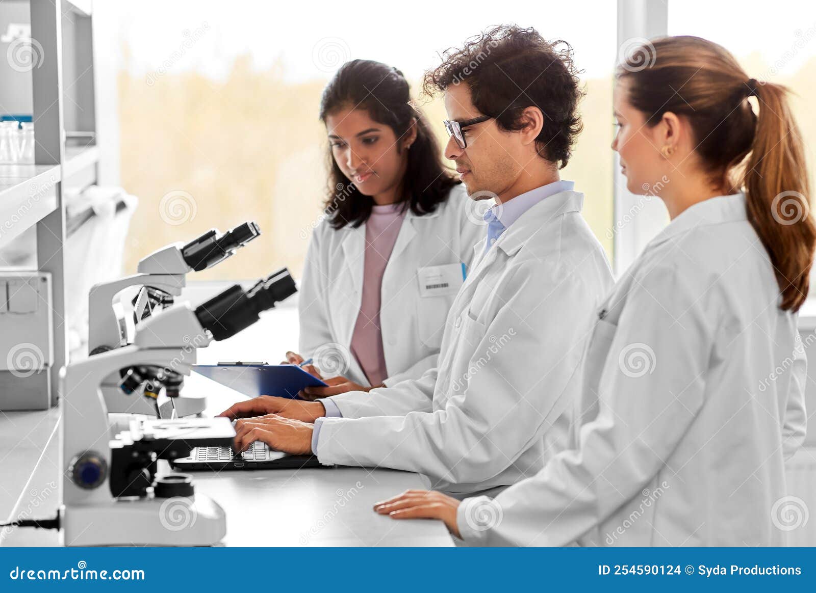 Scientists with Microscopes Working in Laboratory Stock Photo - Image ...