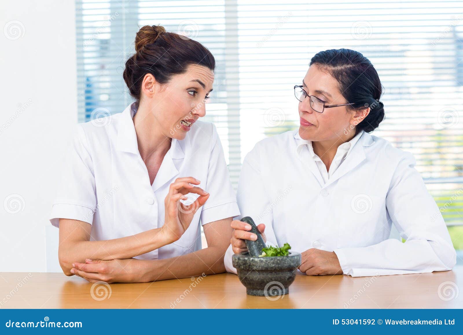 Scientists Mixing Herbs with Pestle and Mortar Stock Photo - Image of ...