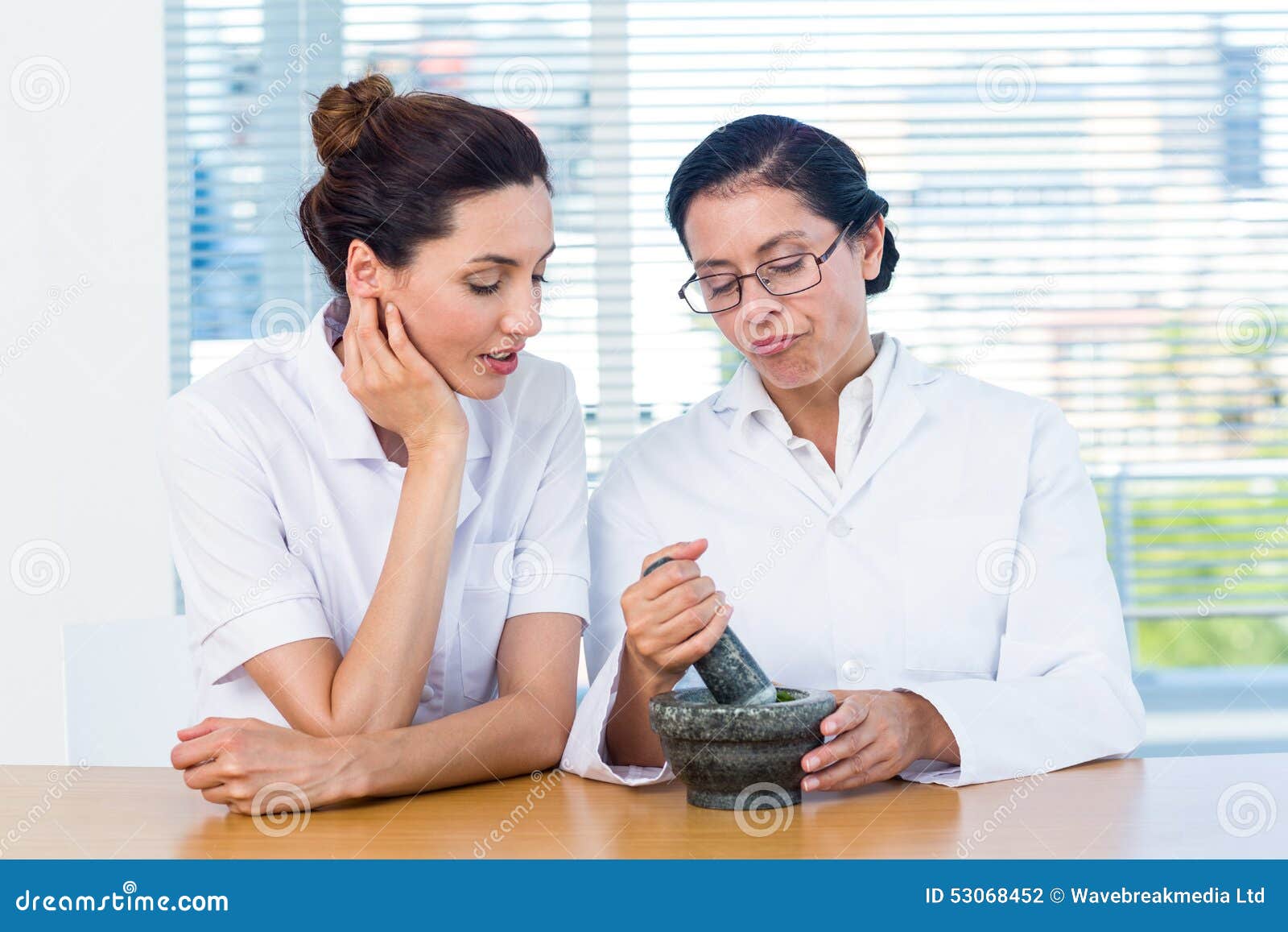 Scientists Mixing Herbs with Pestle and Mortar Stock Photo - Image of ...