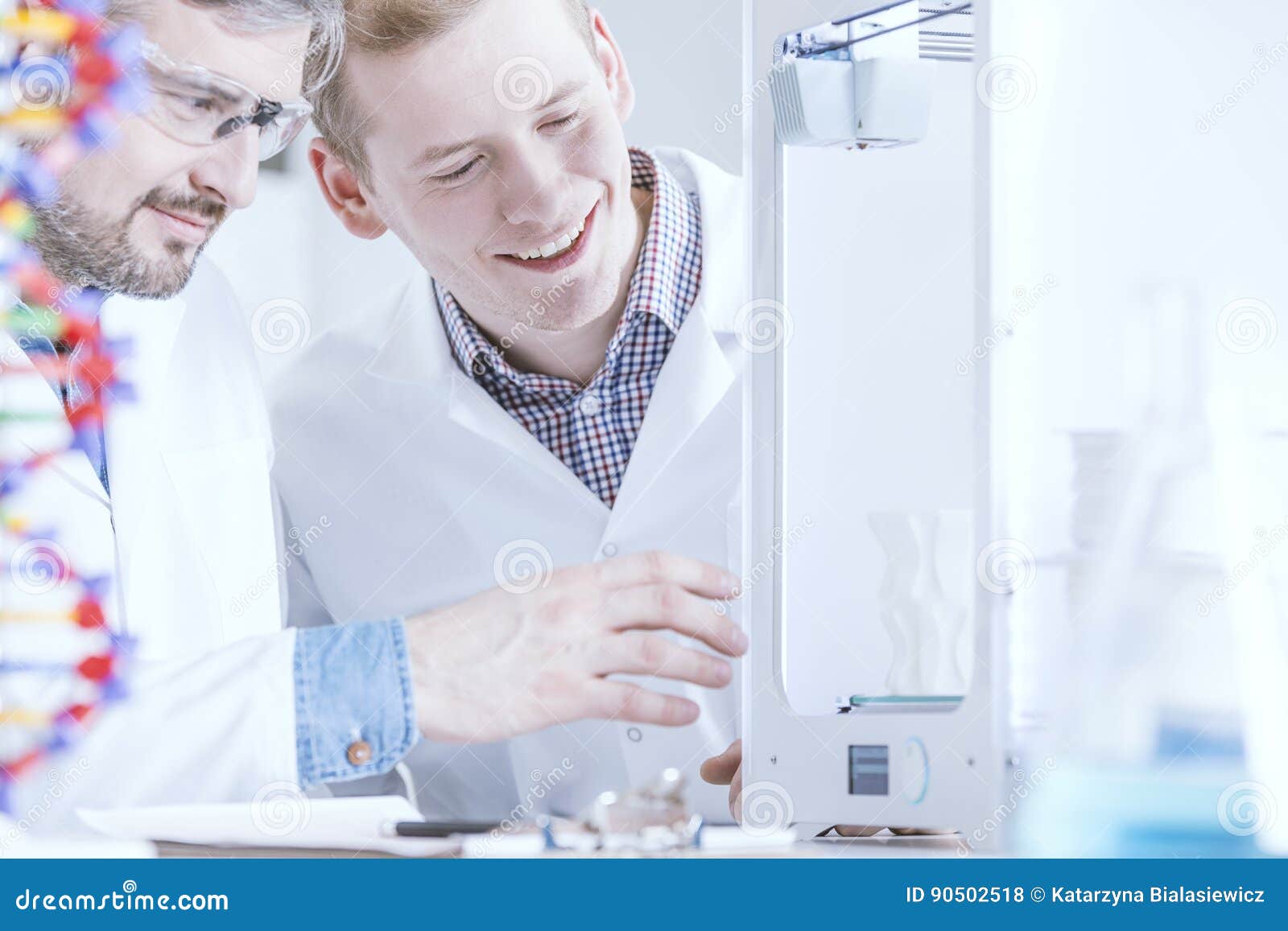 Two Scientists Observing Something With Microscope Stock Photo ...
