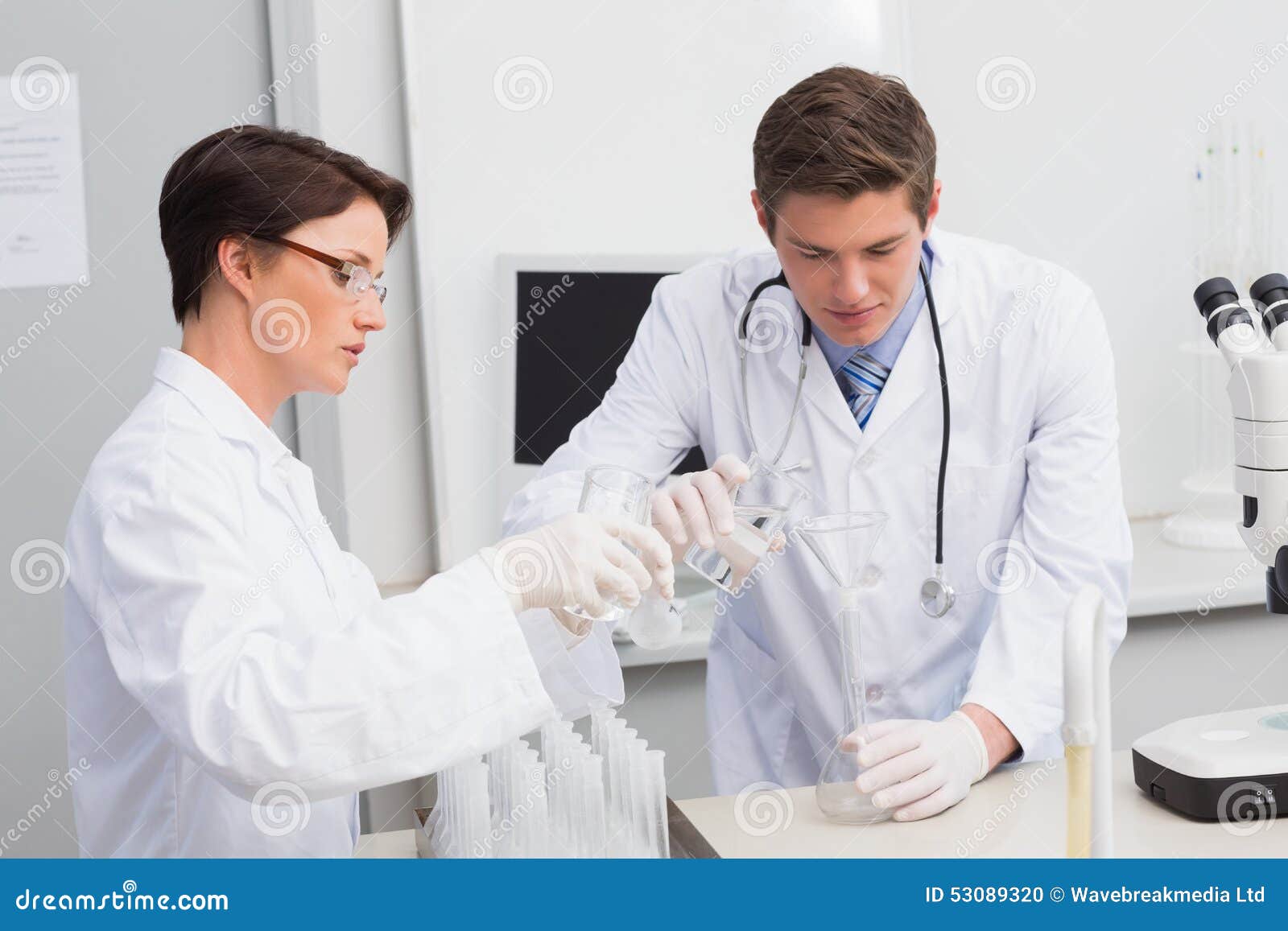 Scientists Pouring Chemical Fluid in Funnel Stock Photo - Image of ...