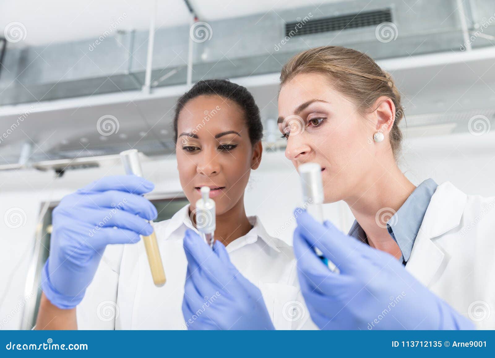 Scientists in Research Lab with Analyzing Instrument Stock Image ...