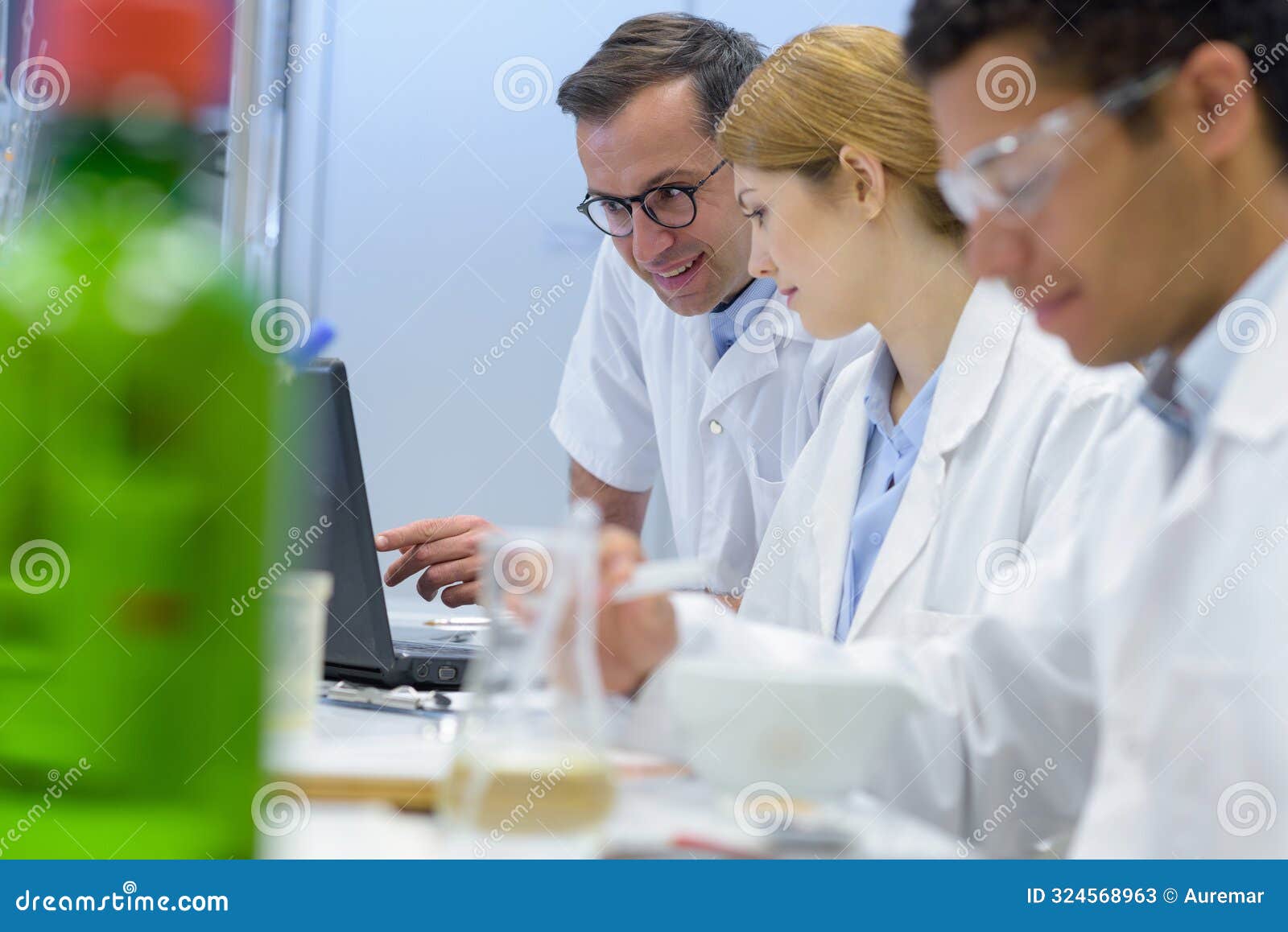 Scientists Sat Working in Row at Laboratory Bench Stock Image - Image ...