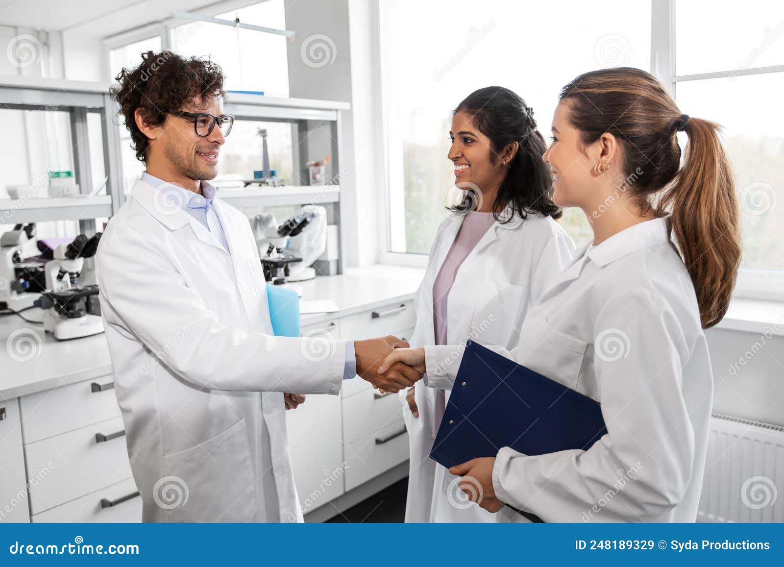 Scientists Shaking Hands in Laboratory Stock Image - Image of agreement ...