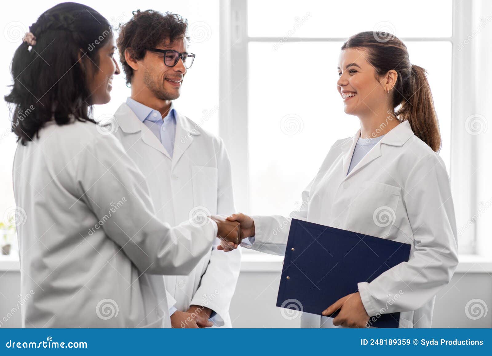 Scientists Shaking Hands in Laboratory Stock Image - Image of greeting ...
