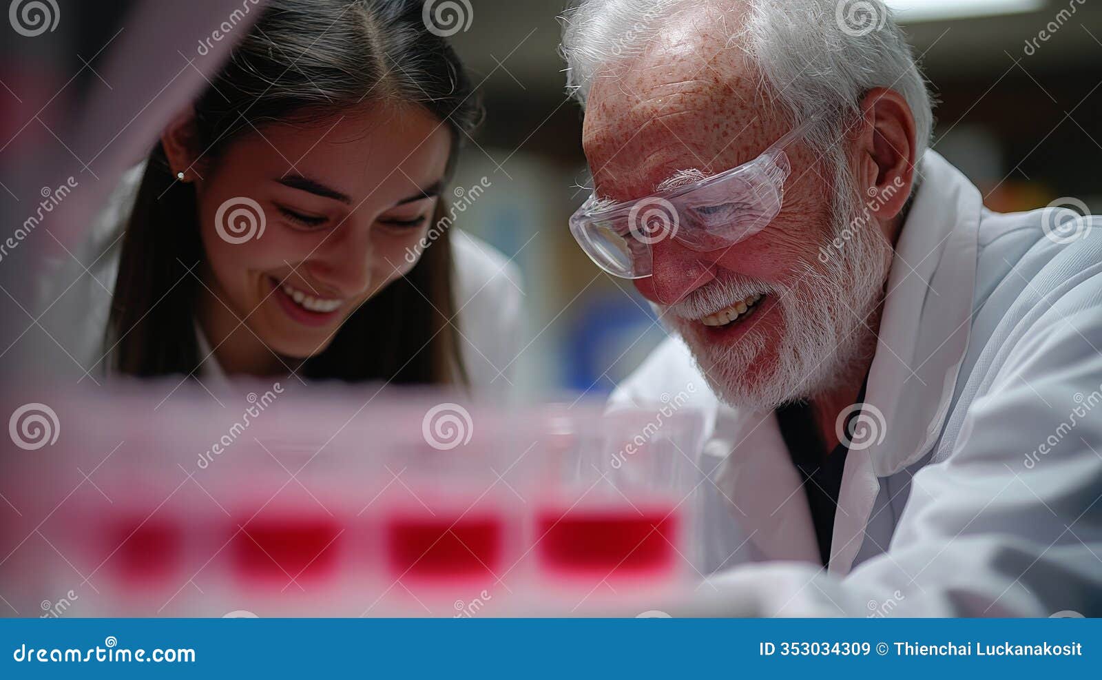 Scientists Smiling while Observing Reactions in Laboratory Setting ...
