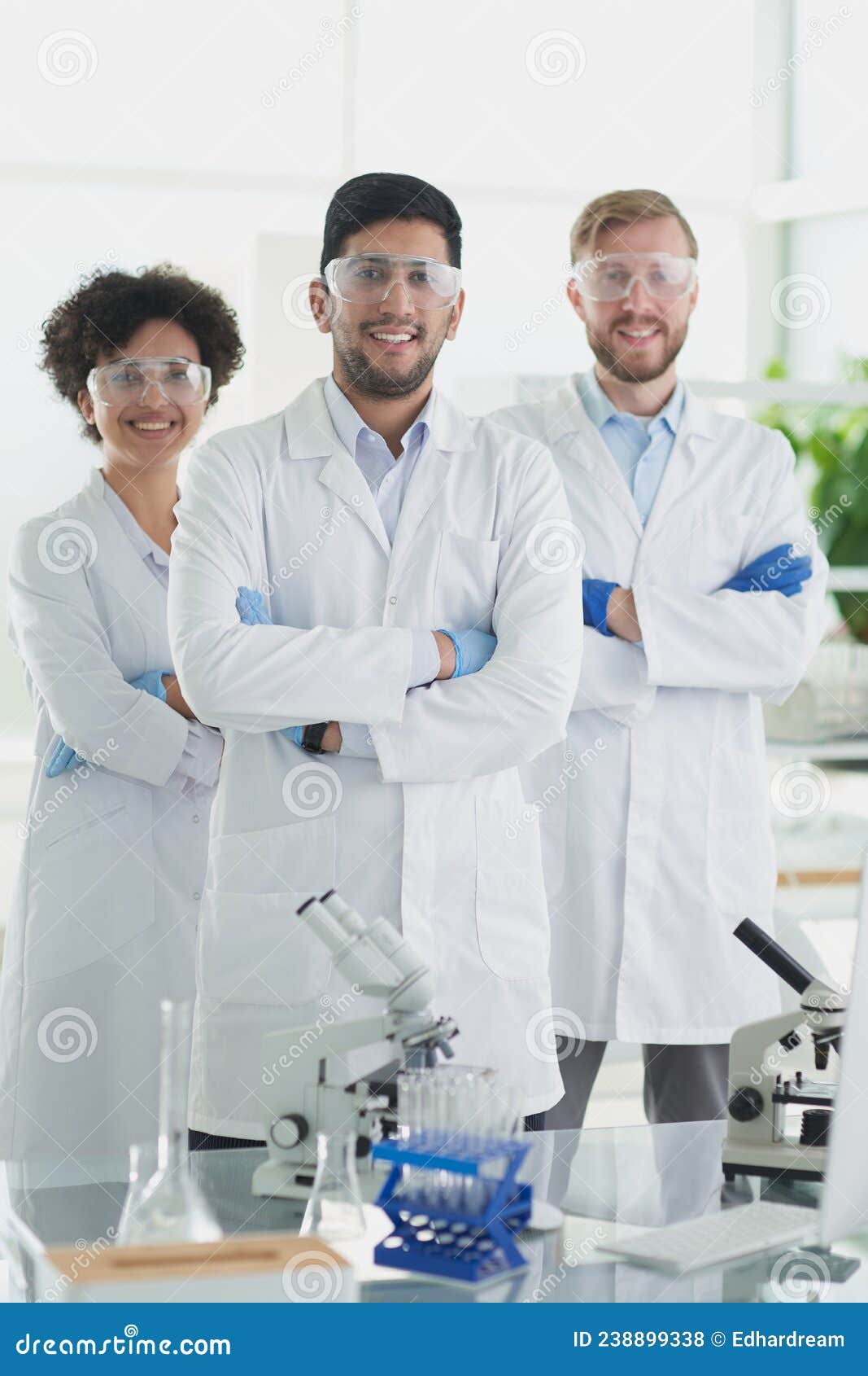 Smiling Scientists Looking at Camera Arms Crossed in Laboratory Stock ...