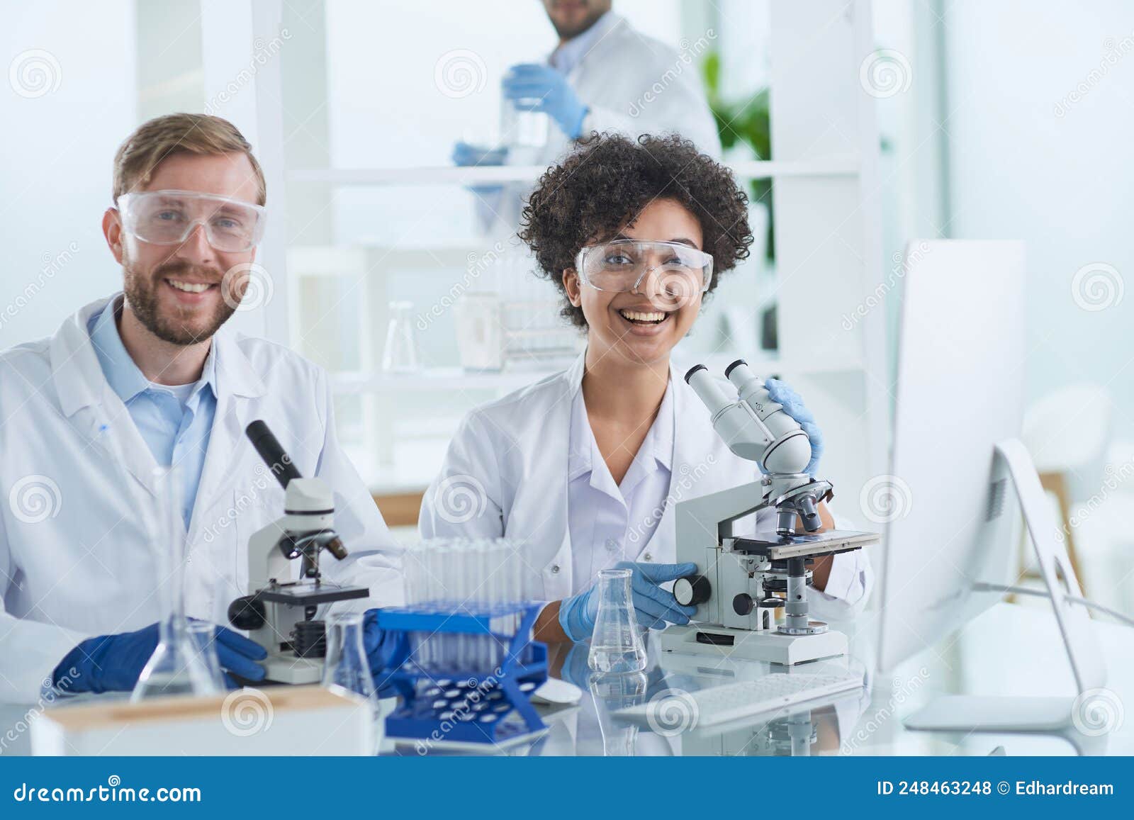 Smiling Scientists Looking at Camera Arms Crossed in Laboratory Stock ...