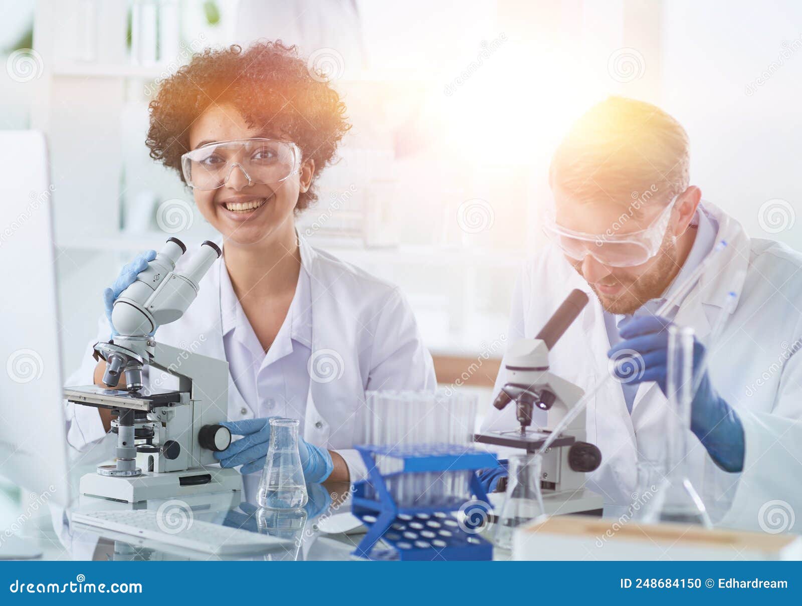 Smiling Scientists Looking at Camera Arms Crossed in Laboratory Stock ...