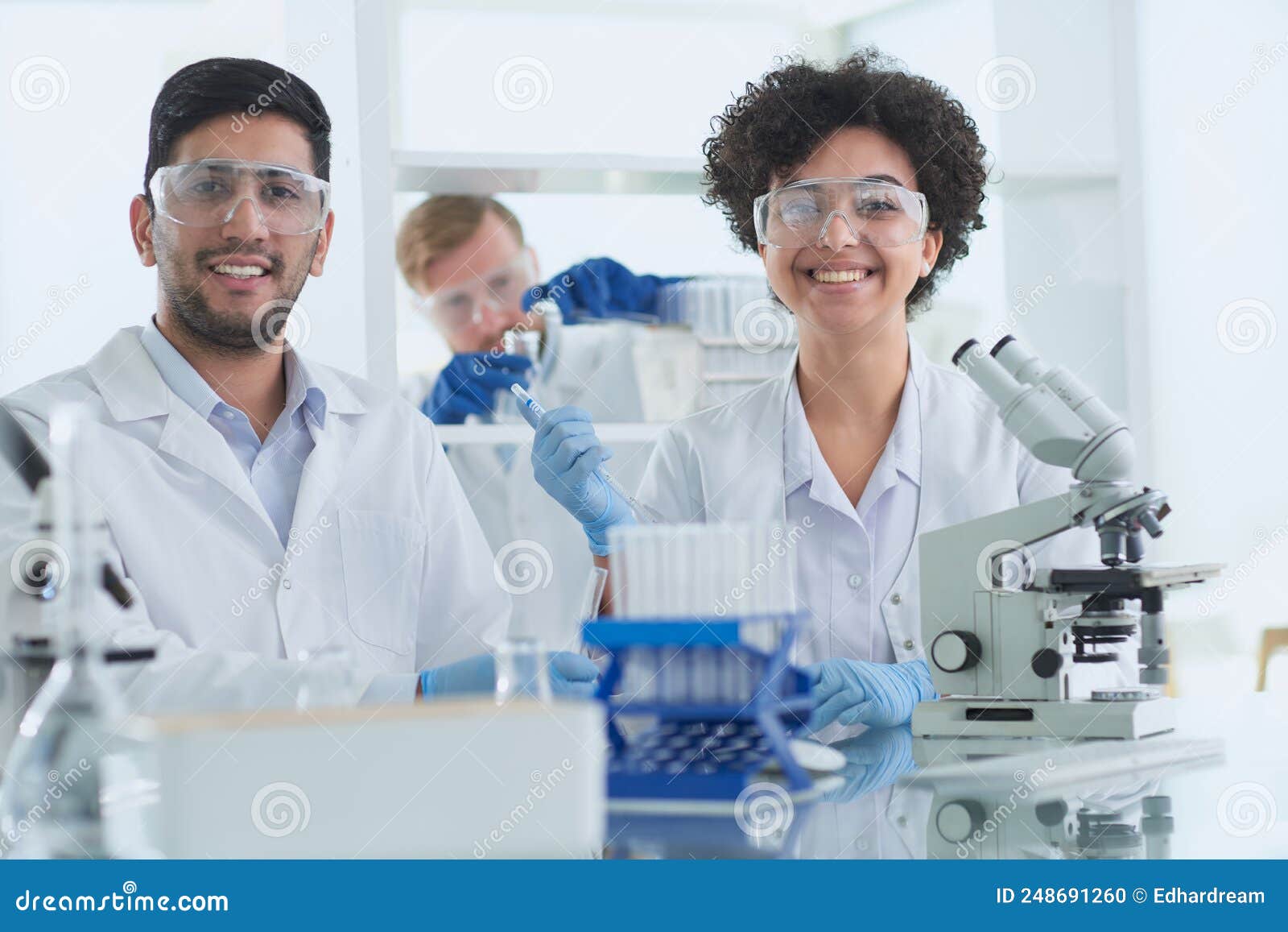Smiling Scientists Looking at Camera Arms Crossed in Laboratory Stock ...