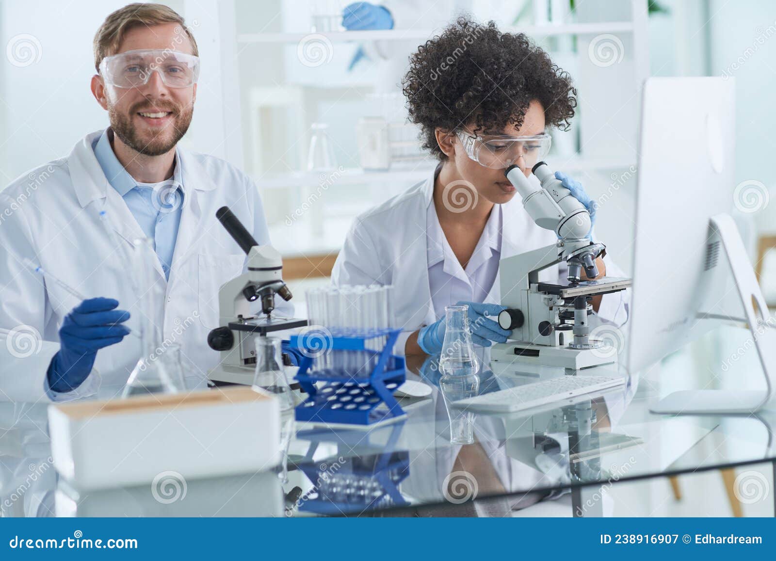 Smiling Scientists Looking at Camera Arms Crossed in Laboratory Stock ...
