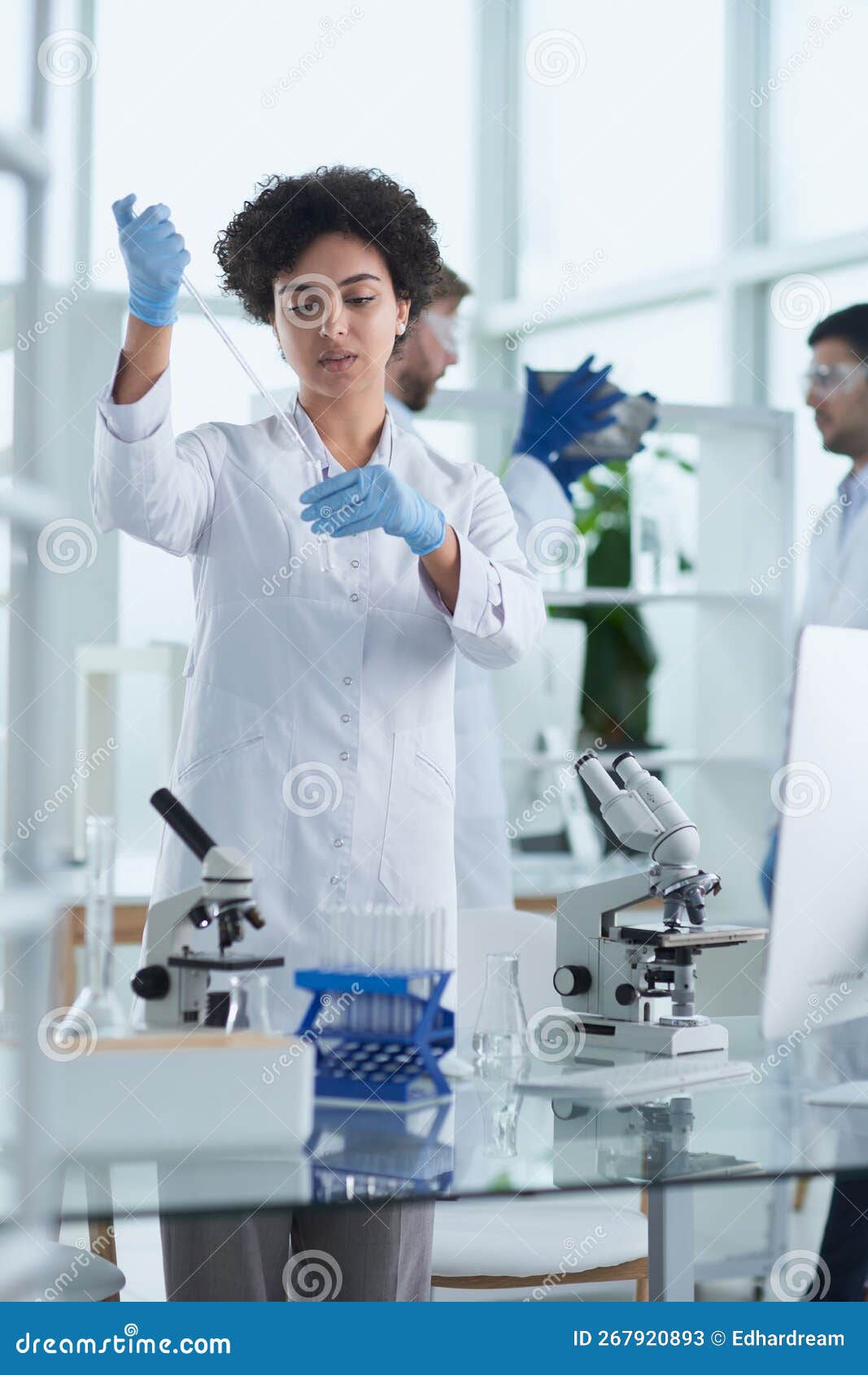 Smiling Scientists Looking at Camera Arms Crossed in Laboratory Stock ...