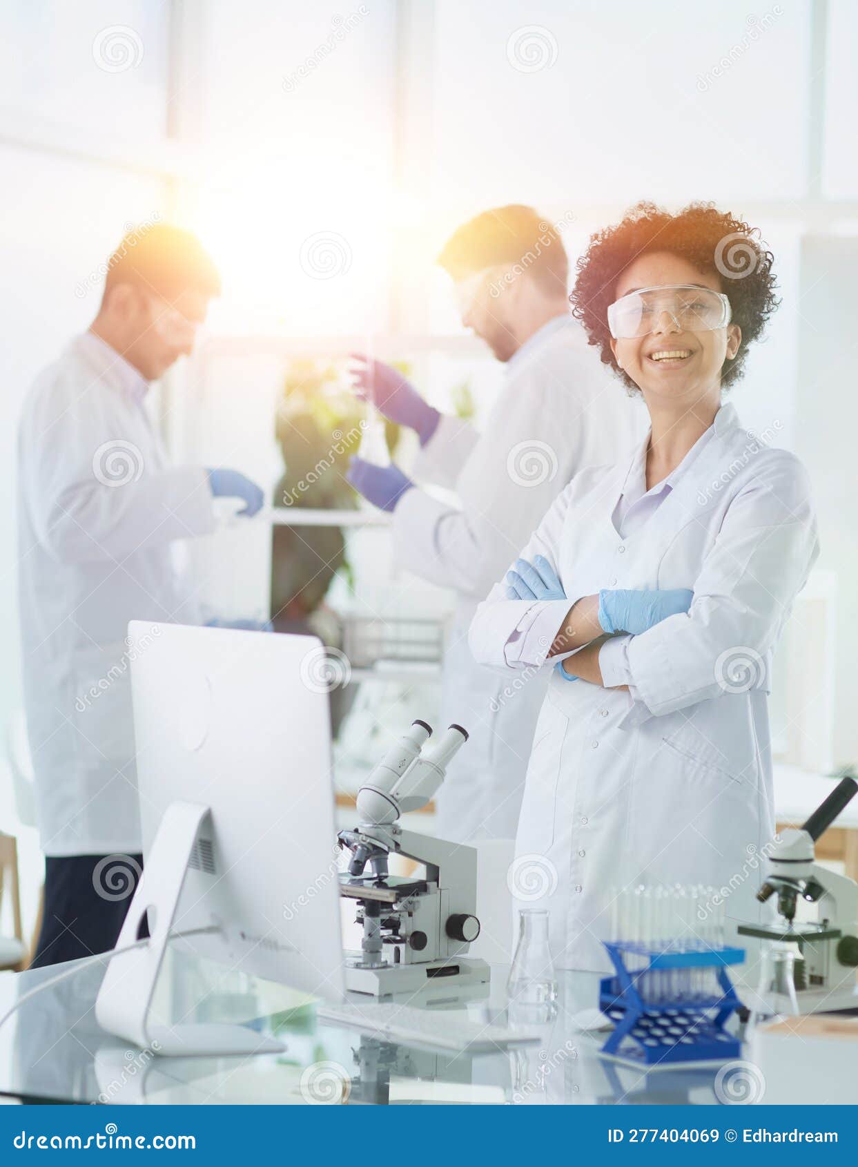 Smiling Scientists Looking at Camera Arms Crossed in Laboratory Stock ...