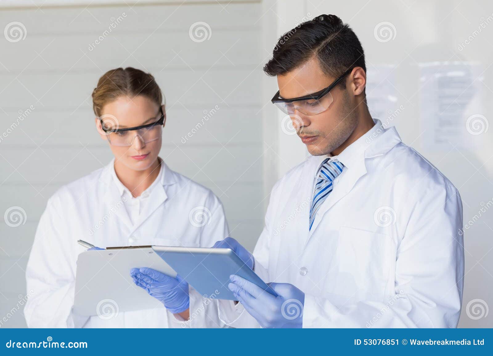 Scientists taking notes stock image. Image of experiment - 53076851