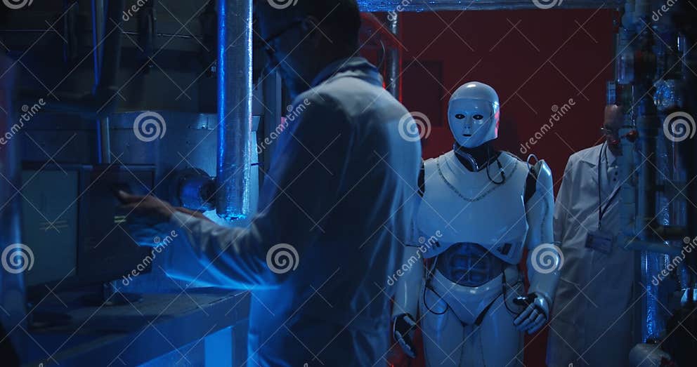 Scientists Testing Humanoid Robot Stock Photo - Image of examining ...