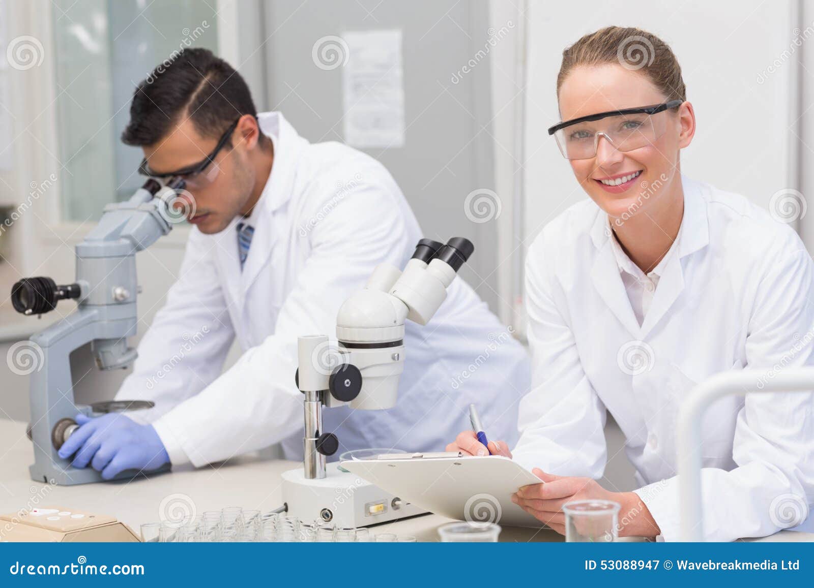 Scientists Using Microscope Stock Image - Image of medical, dish: 53088947 Scientists Using Microscope Stock Image - Image of medical, dish: 53088947