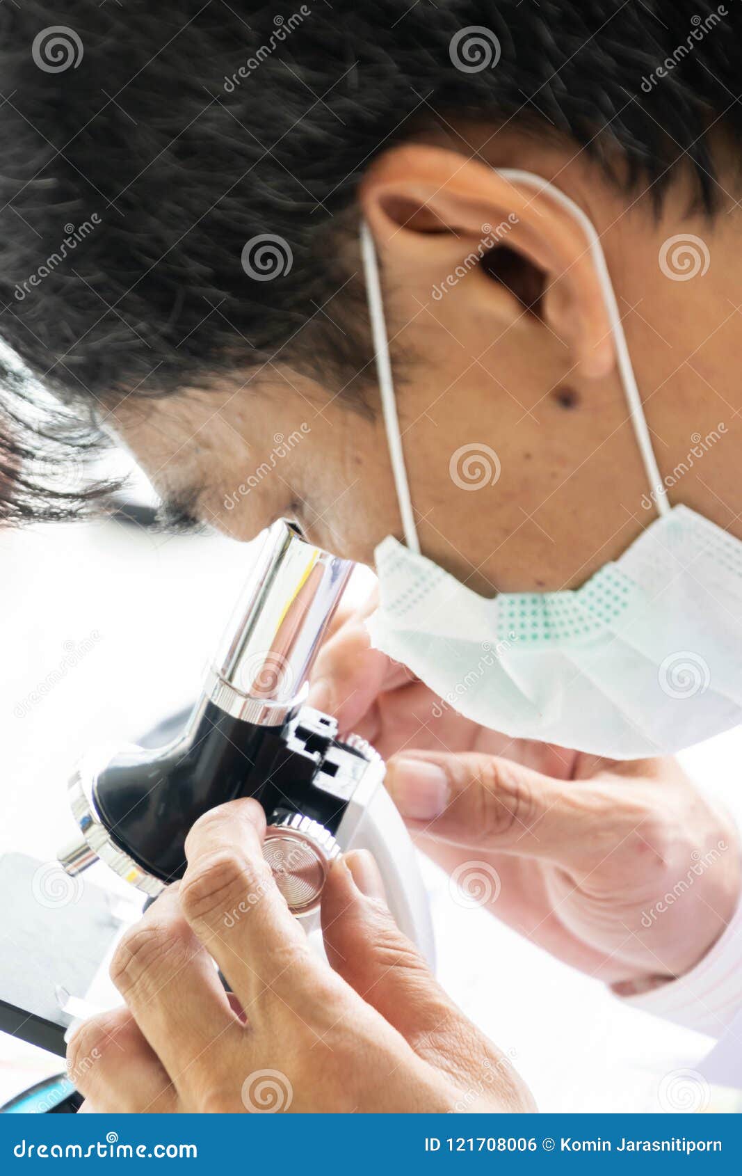 Scientists are Using a Microscope. Stock Photo - Image of male ... Scientists are Using a Microscope. Stock Photo - Image of male ...