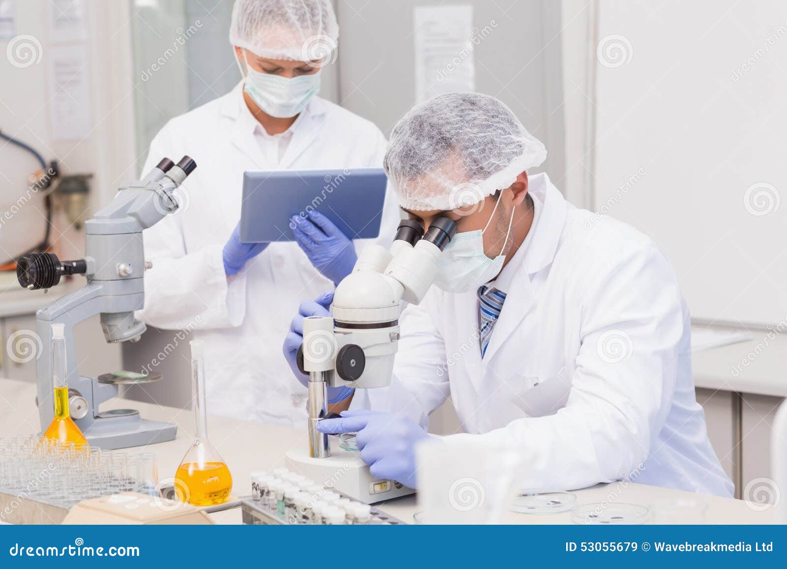 Scientists Using Tablet Pc and Microscope Stock Image - Image of ...