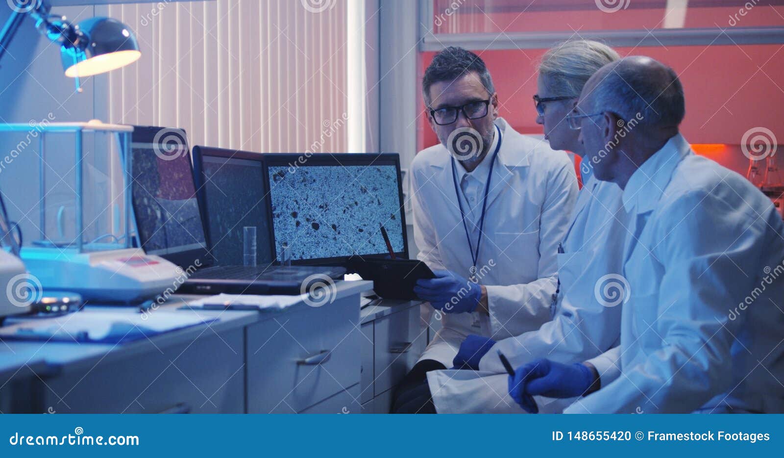 Scientists Watching Monitor and Analyzing Stock Photo - Image of ...