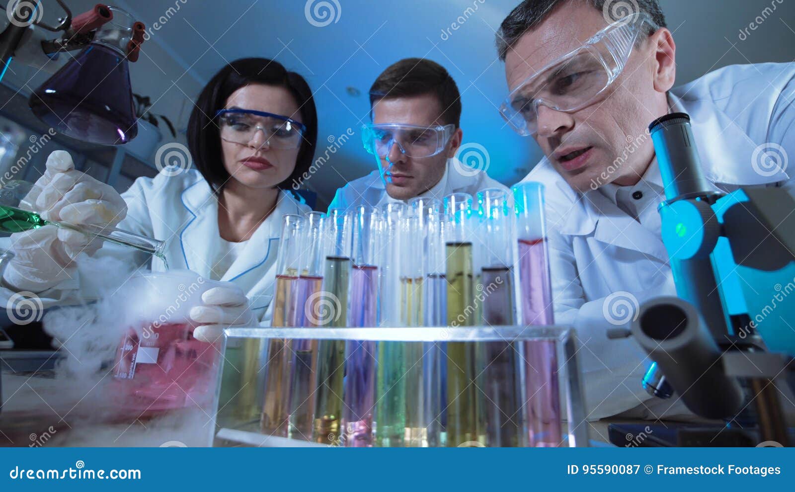 Scientists Watching Reactions in Test Tubes Stock Image - Image of ...