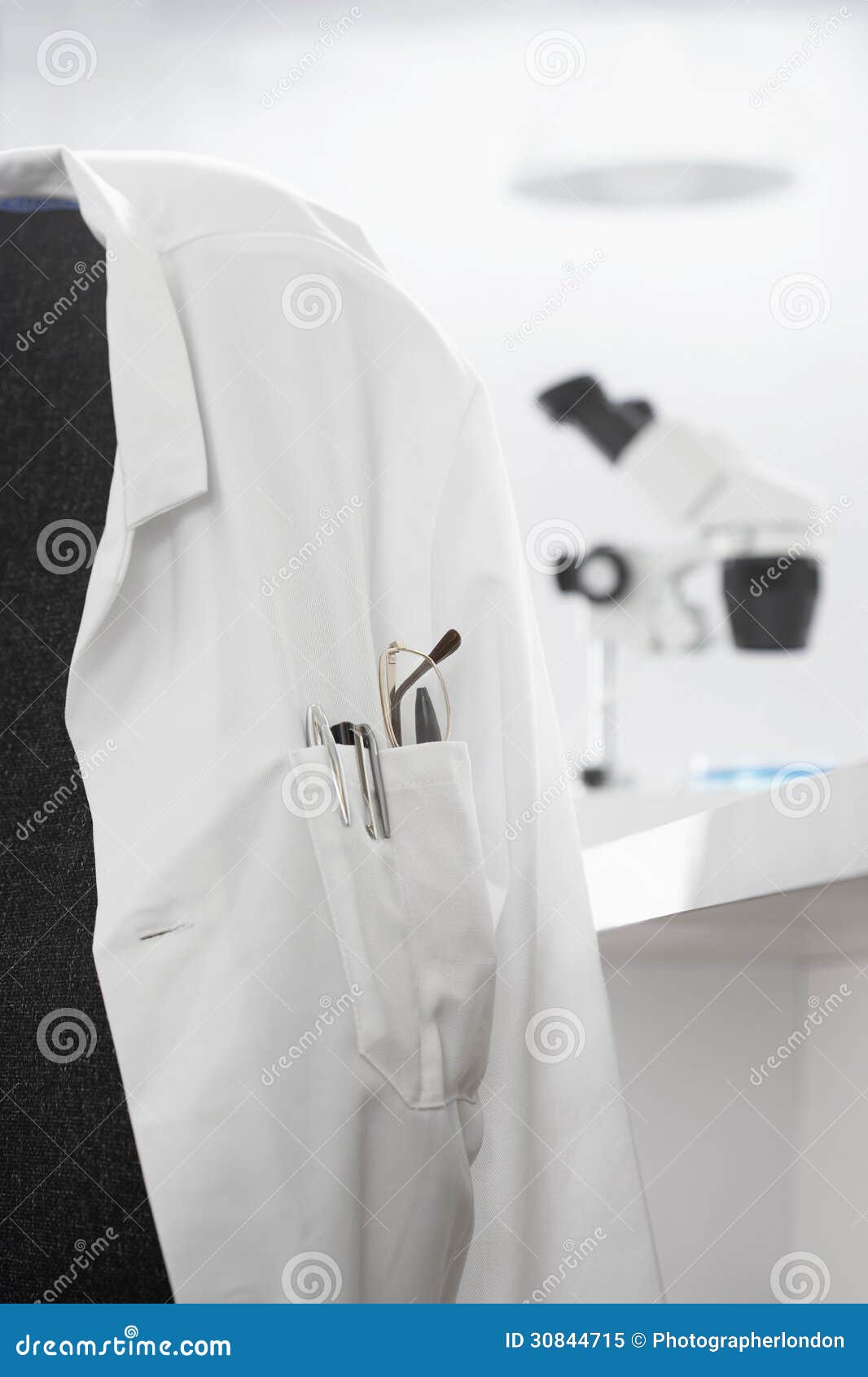 Scientists In White Coats Making Experiment With Reagents And ...