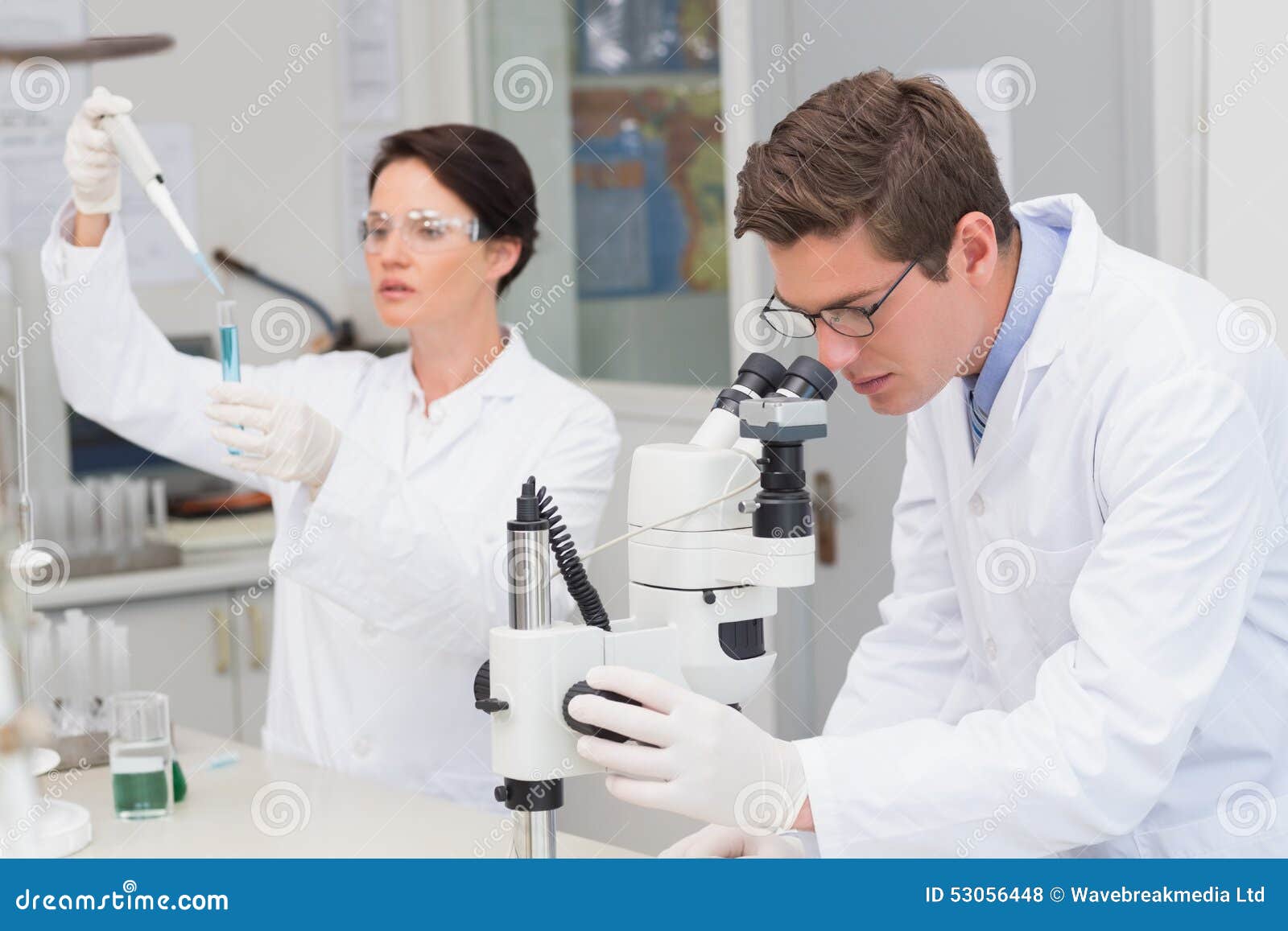 Scientists Working with Microscope and Test Tube Stock Photo - Image of ...
