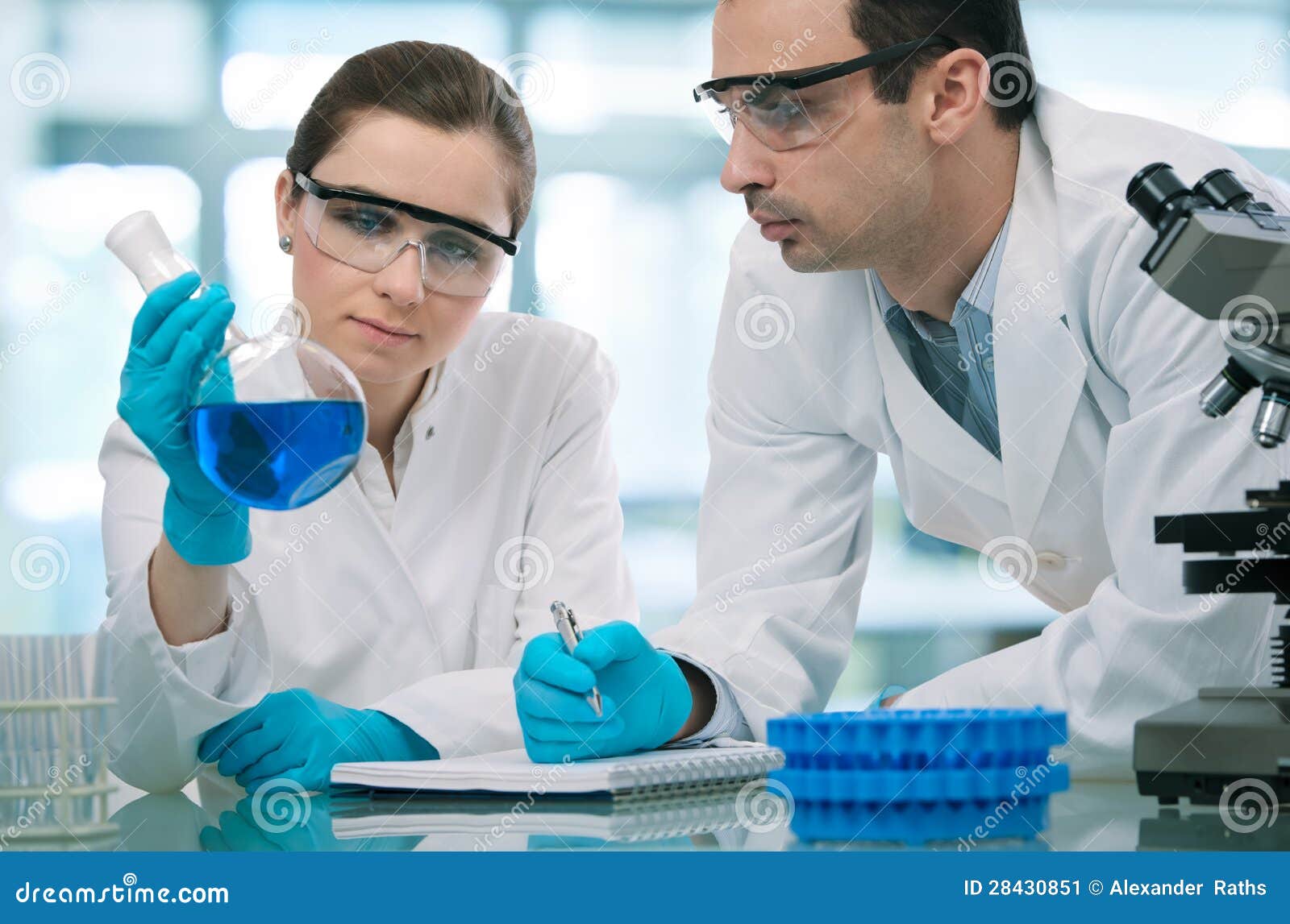 Scientists Working in a Research Laboratory Stock Image - Image of ... Scientists Working in a Research Laboratory Stock Image - Image of ...