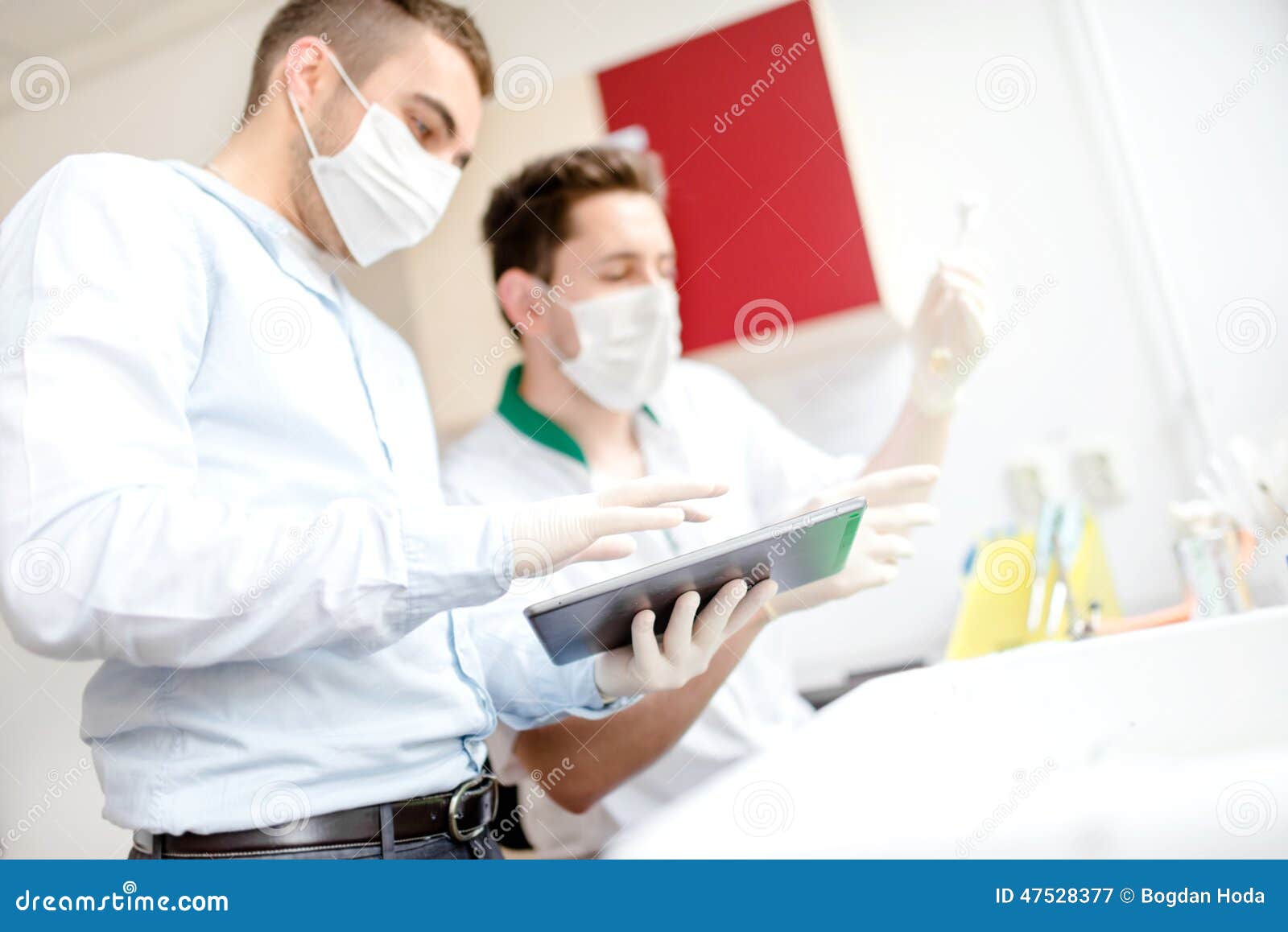 Scientists Working on Tablet in Laboratory with Experiments and Tools ...