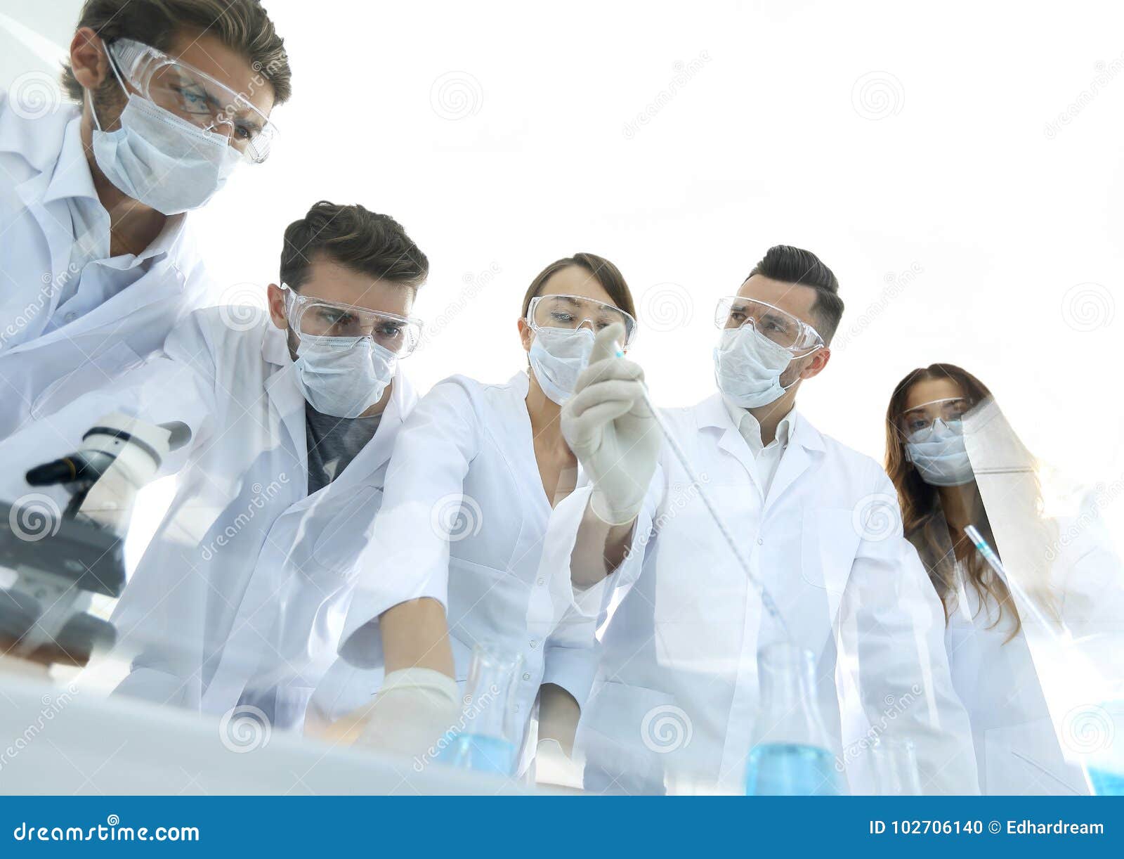 Scientists Working with Test Tubes and Microscope in the Laboratory ... Scientists Working with Test Tubes and Microscope in the Laboratory ...