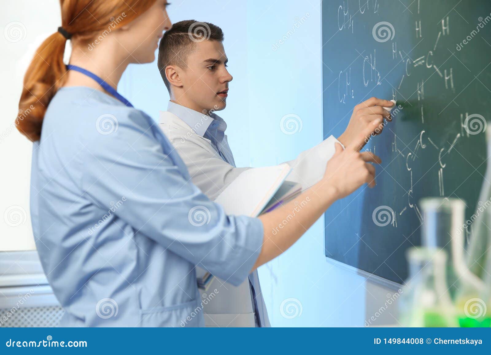 Scientists Writing Chemical Formulas on Chalkboard Stock Photo - Image ...