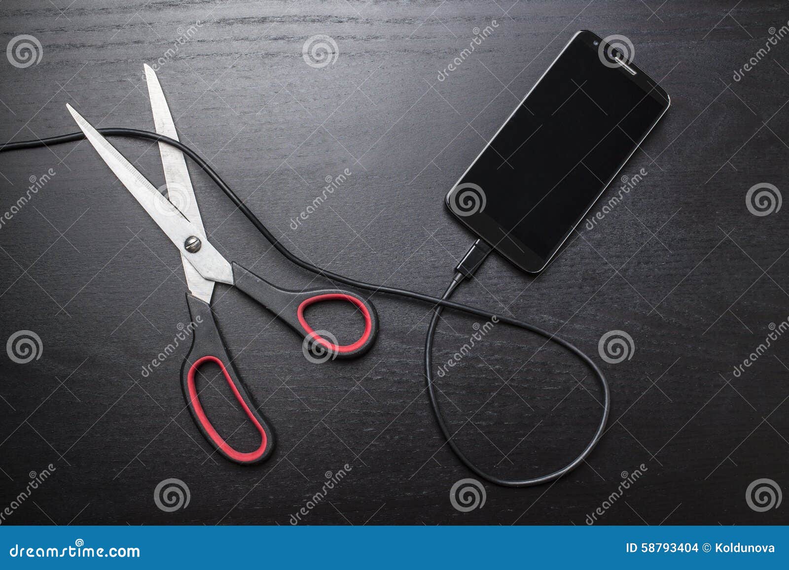 Scissors Cut the Cable Connected To a Mobile Phone Stock Photo - Image ...