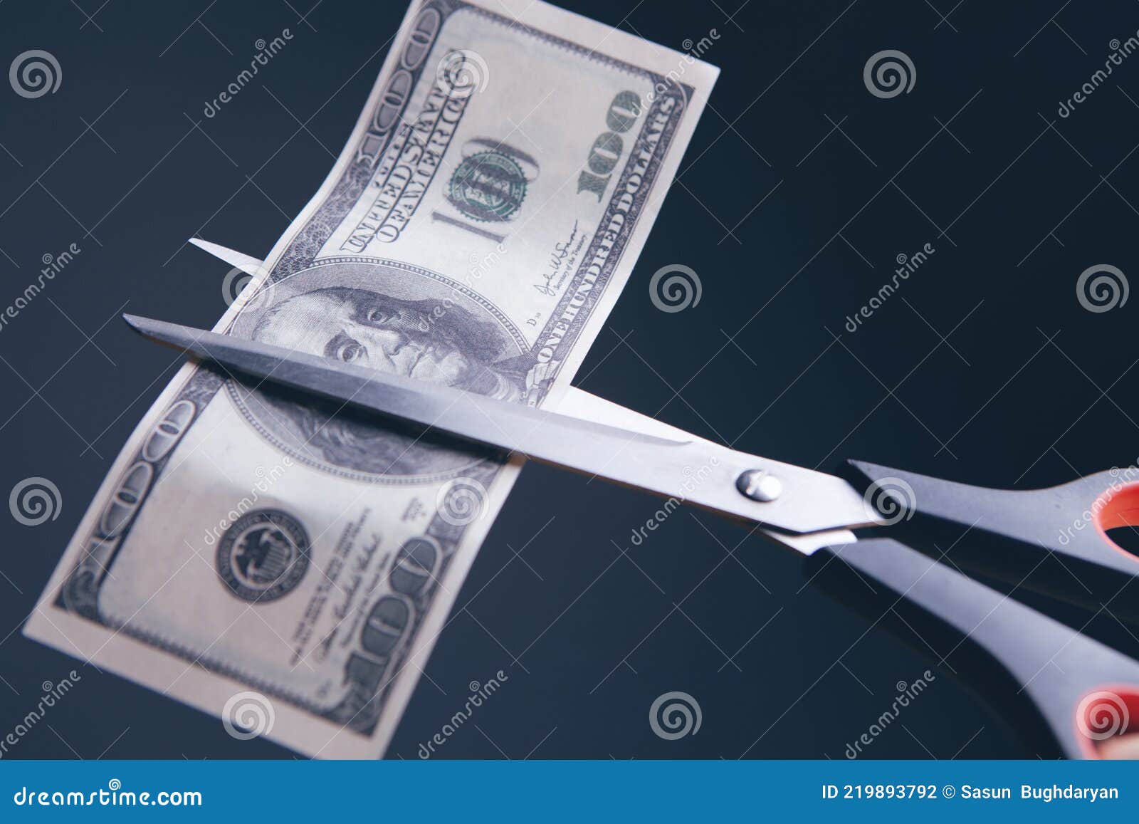 Scissors Cut a Dollar Bill in Half Stock Photo - Image of cutting ...