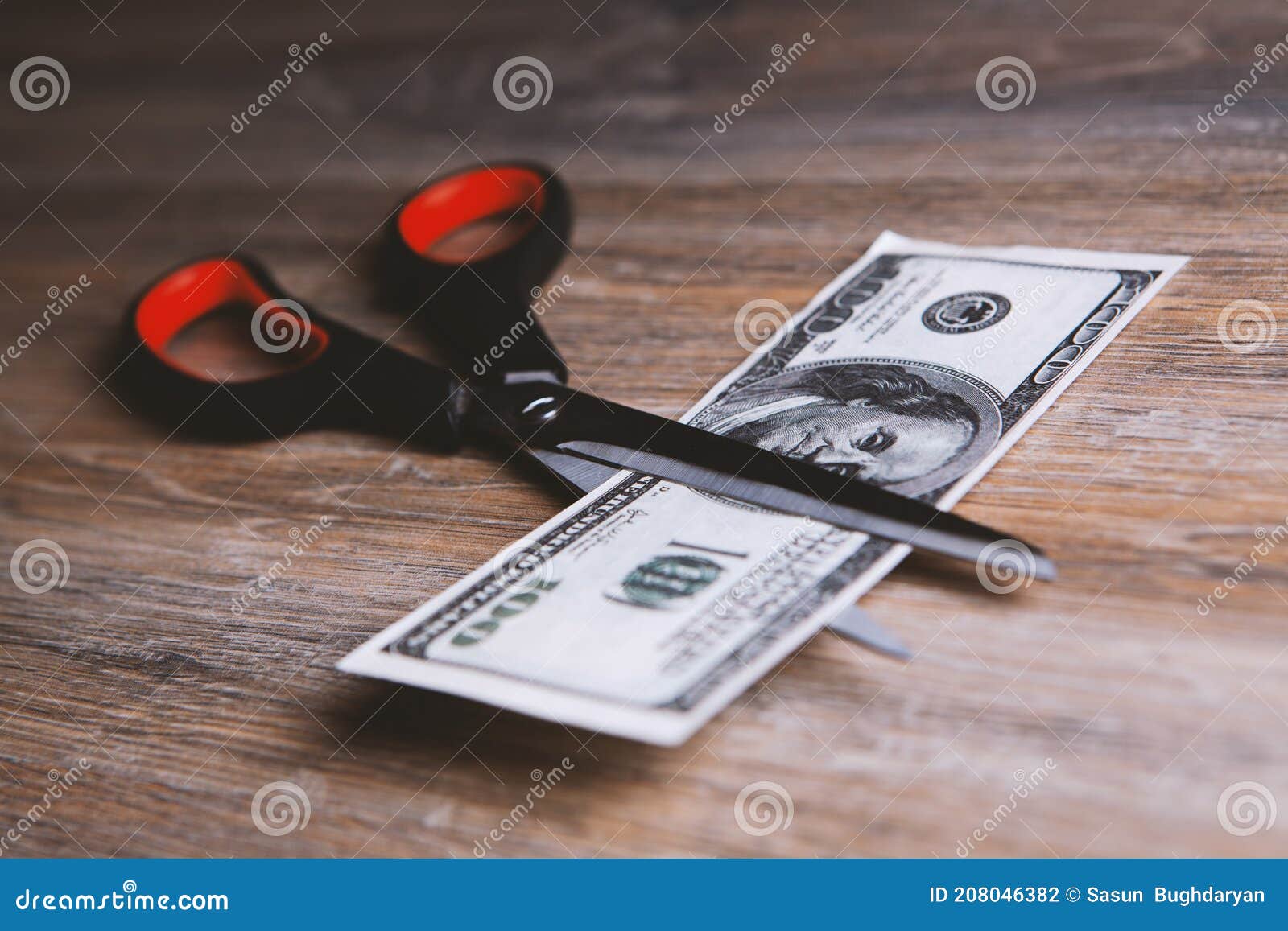 Scissors Cut a Dollar Bill in Half Stock Photo - Image of cost, costs ...
