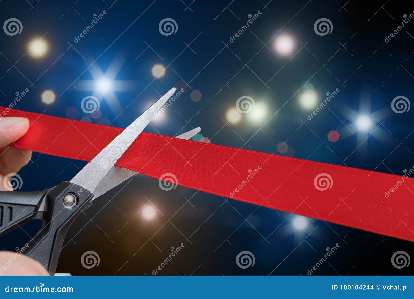 Scissors are Cutting Red Ribbon or Tape. Flashing Lights in Background ...